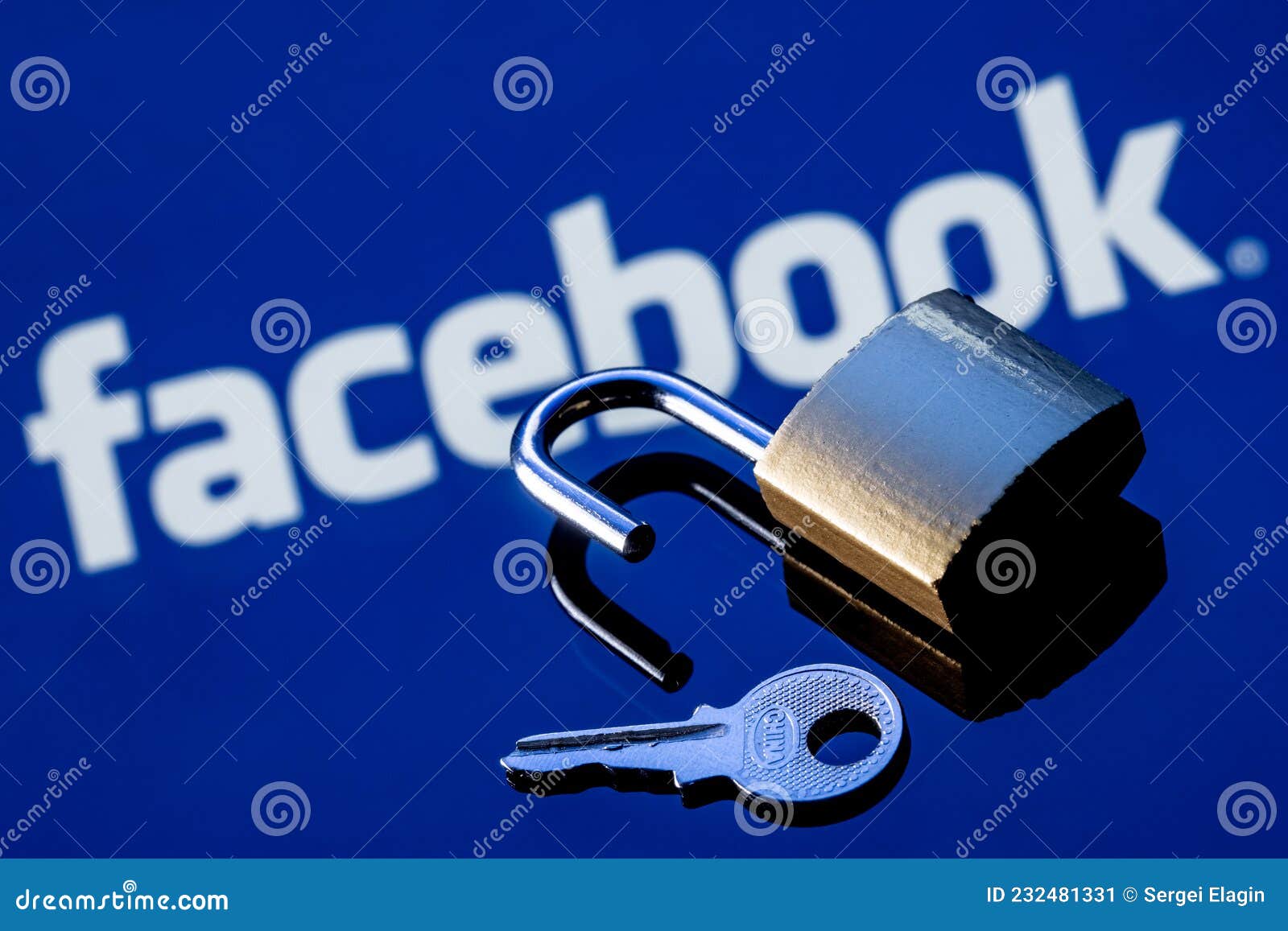 An Open Security Lock and Key on the Background of the Facebook Social ...