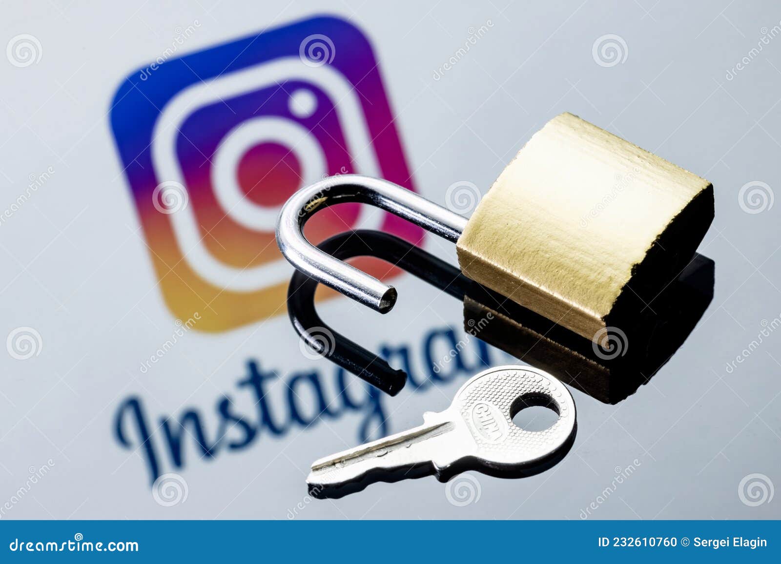 An Open Security Lock and Key on the Background of the Instagram Social ...
