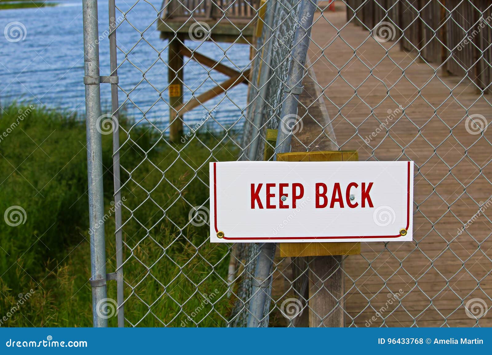 A Keep Back Sign on a Chain-link Fence Stock Photo - Image of alberta ...