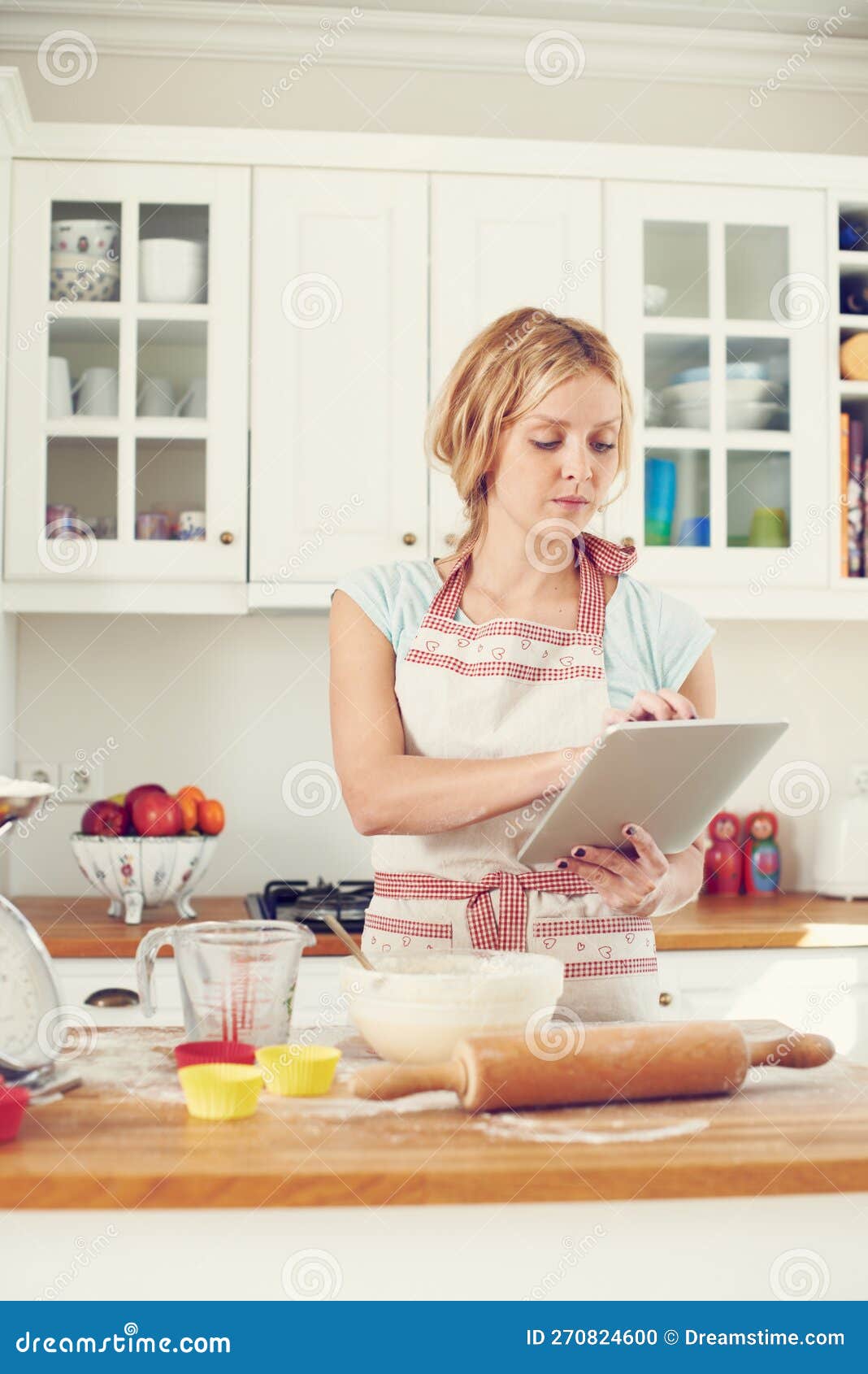 Keep Calm and Bake on. a Young Woman Baking in Her Kitchen. Stock Photo ...