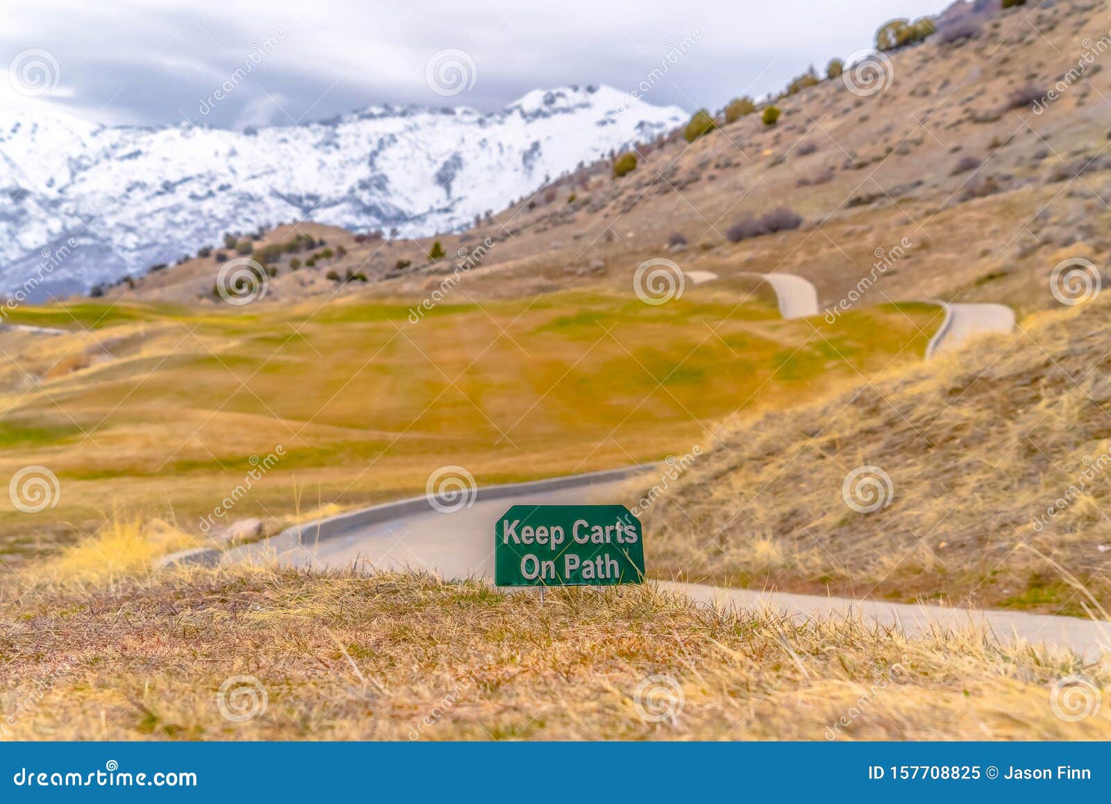 Keep Carts on Path Sign beside a Narrow Pathway that Winds through a ...