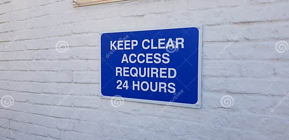 Keep Clear Access Required 24 Hours Sign. Stock Photo - Image of ...