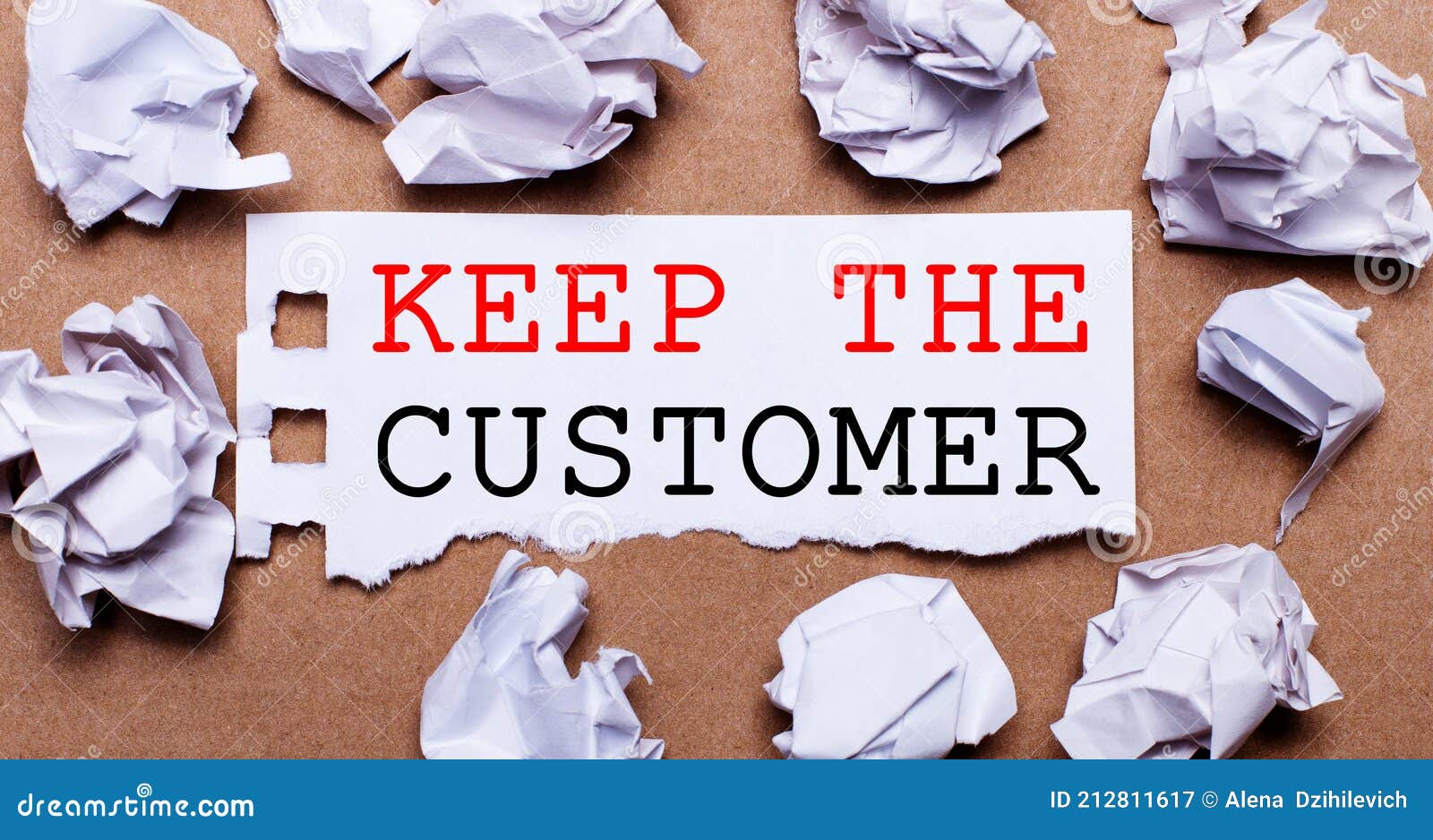 KEEP the CUSTOMER Written on White Paper on a Light Brown Background ...