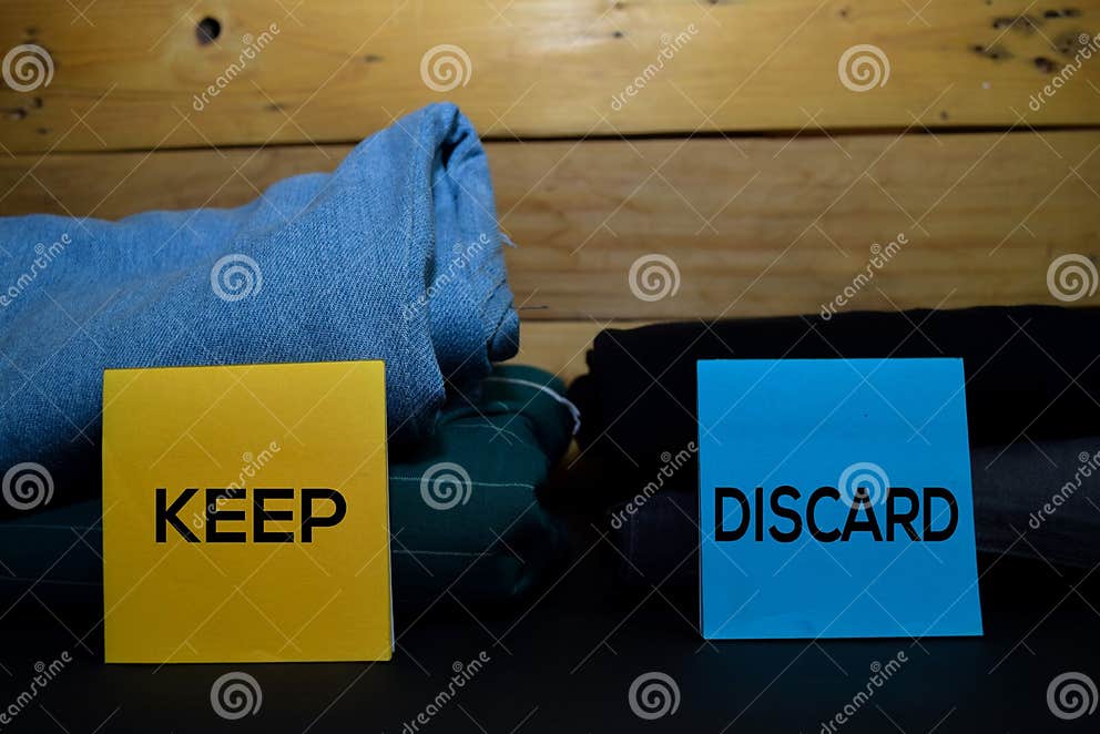 Keep and Discard Write on a Sticky Note between Fashion Clothes Folded ...