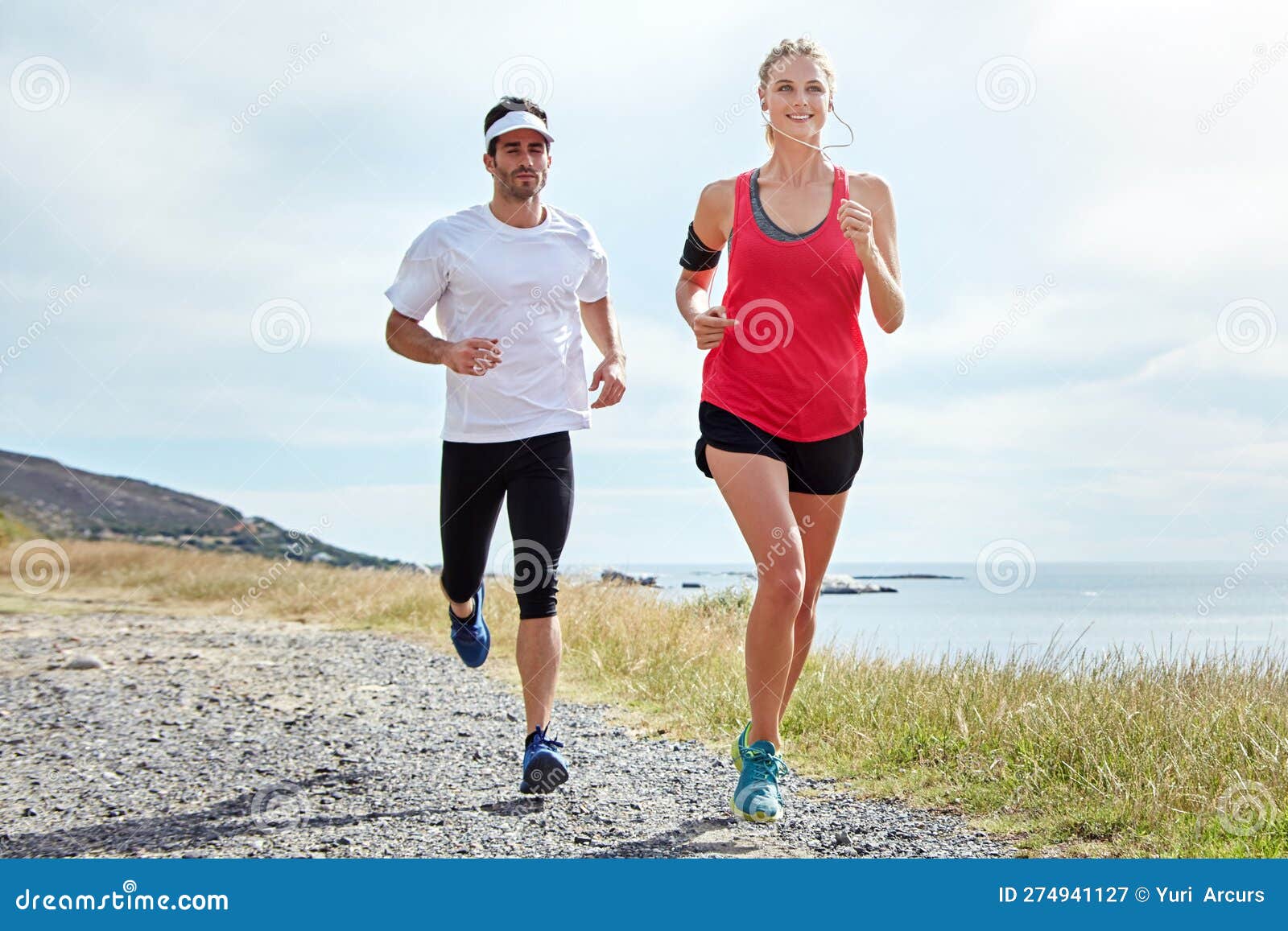 They Keep Each Motivated. a Young Couple Going for a Run Together ...