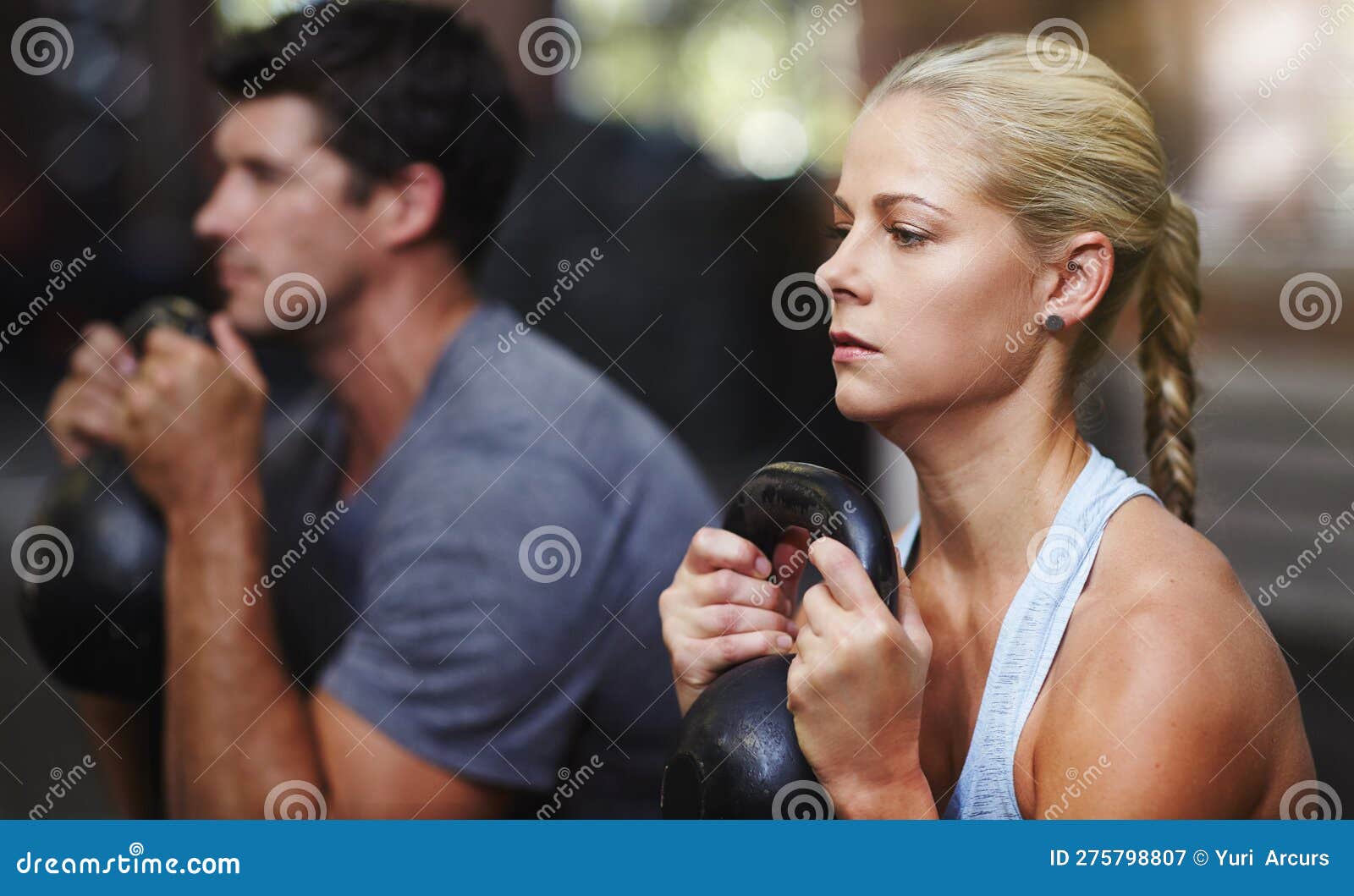 They Keep Each Other Striving. Two People Working Out with Kettlebells ...