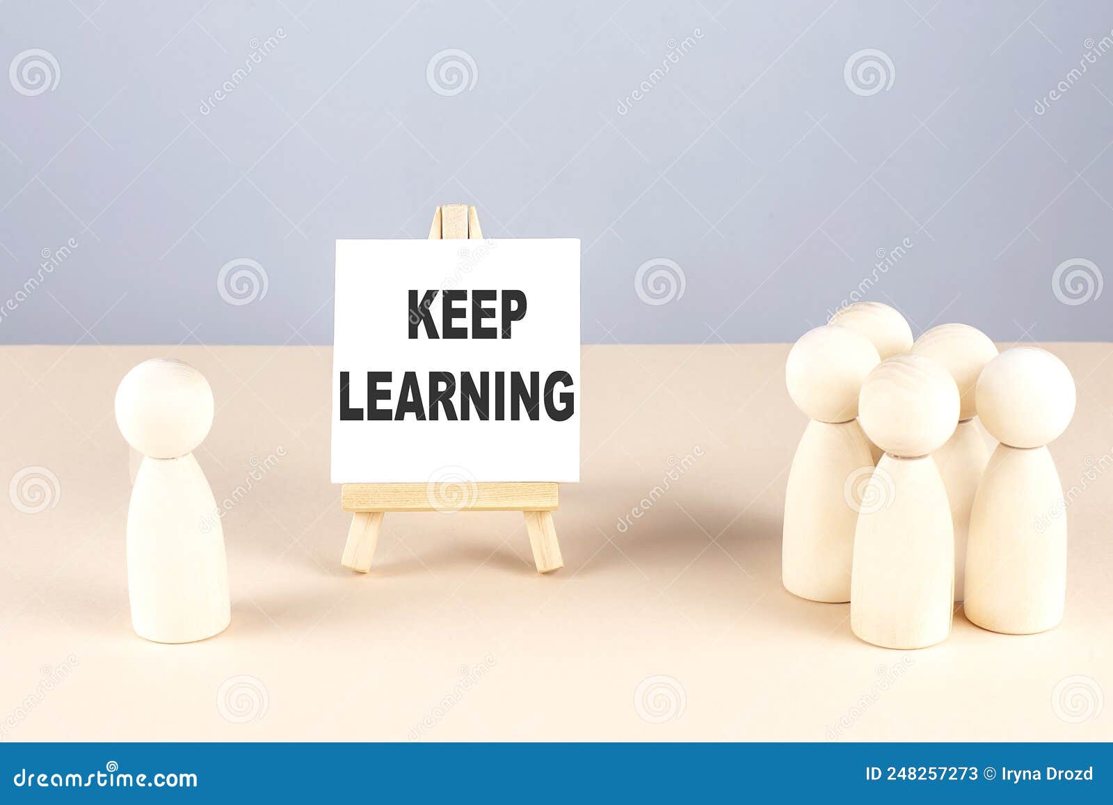 KEEP LEARNING Text on Easel with Wooden Figure, Meeting Concept Stock ...