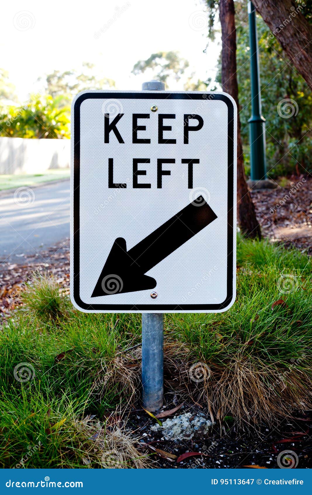 Keep Left Road Sign stock image. Image of roadside, green - 95113647