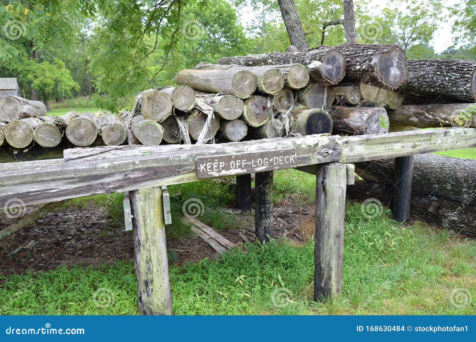 Keep Off Log Deck Sign with Wood Structure and Logs Stock Photo - Image ...