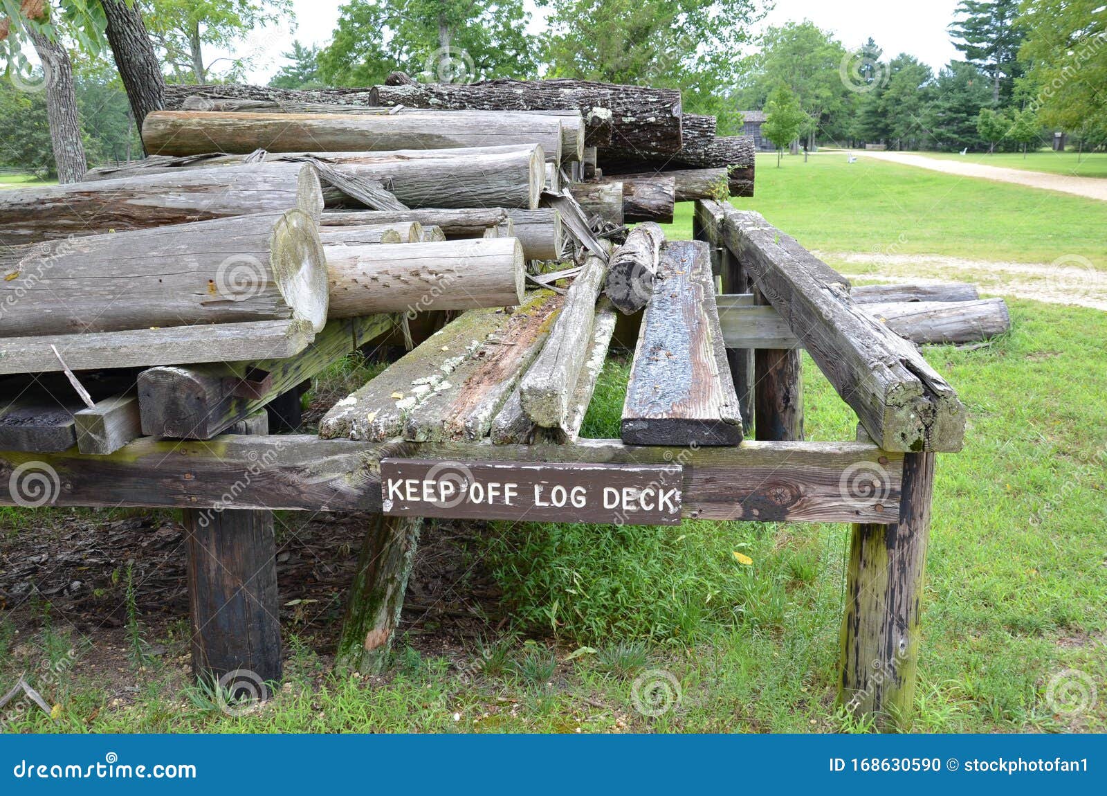 Keep Off Log Deck Sign with Wood Structure and Logs Stock Photo - Image ...