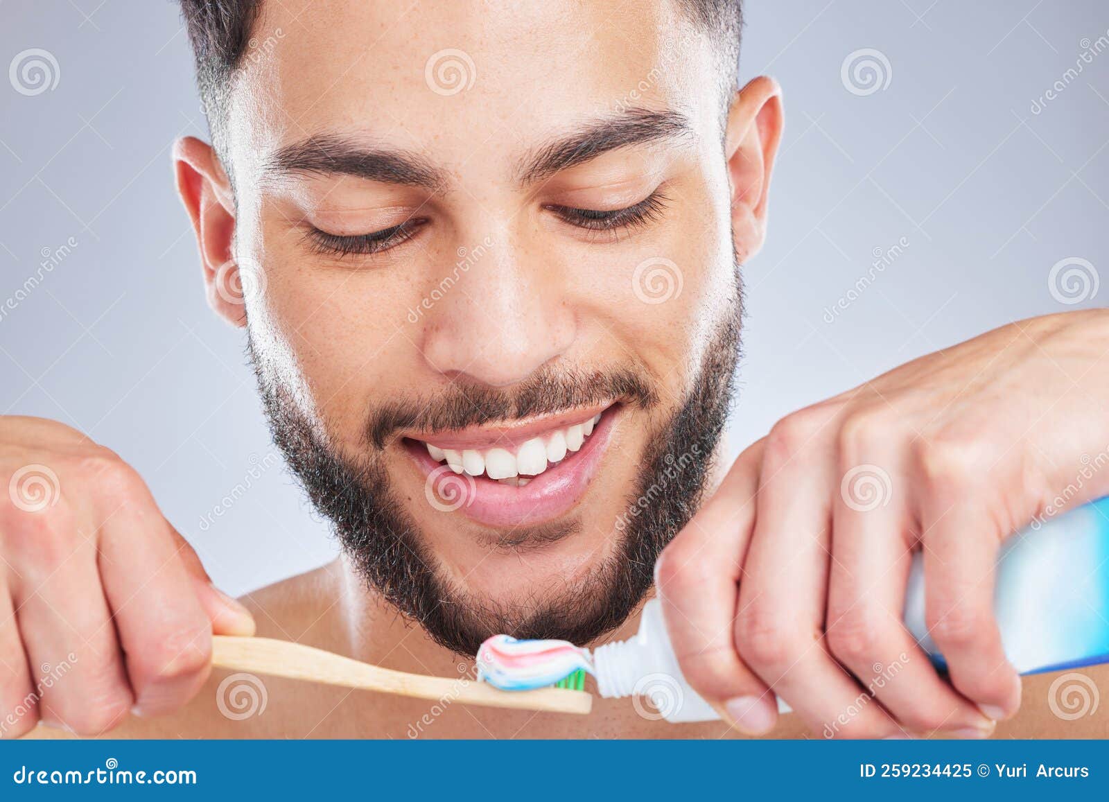 Keep those Pearly Whites on Point. Studio Shot of a Handsome Young Man ...