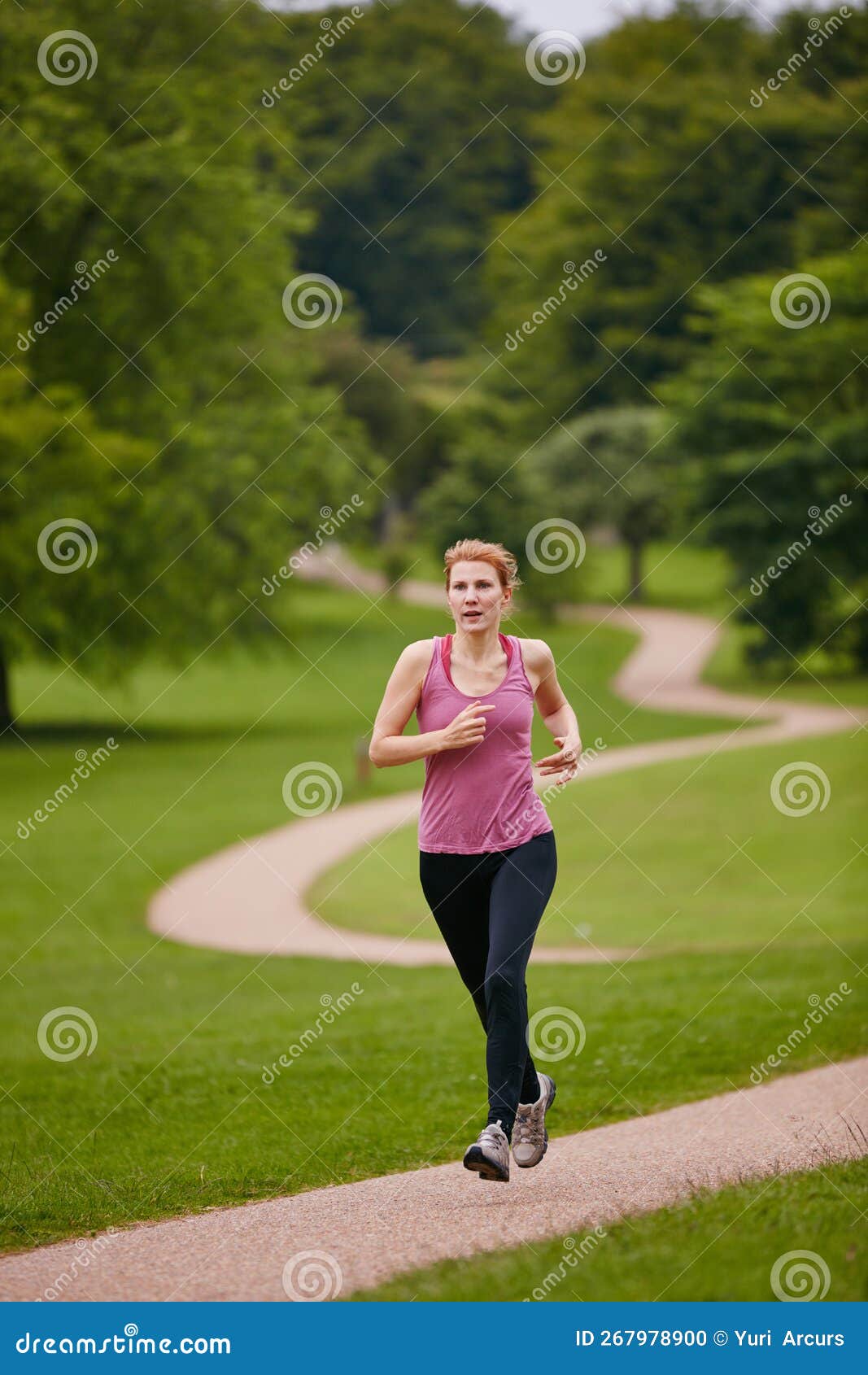 Keep Putting One Foot in Front of the Other. a Woman Jogging Along a ... Keep Putting One Foot in Front of the Other. a Woman Jogging Along a ...