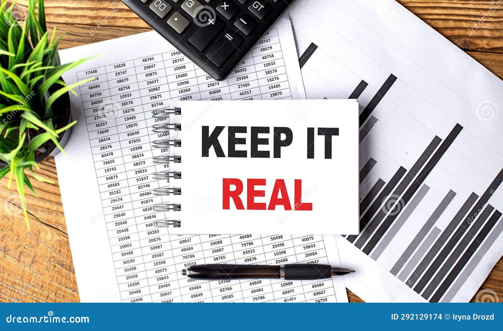 KEEP it REAL Text on a Notebook with Chart and Calculator Stock Photo ...