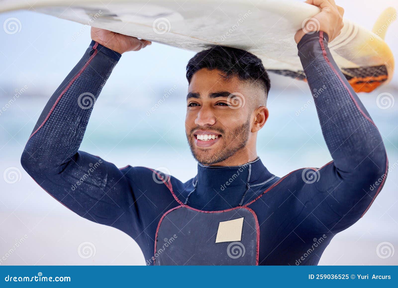 Keep it Simple - Surf More. a Handsome Young Man Carrying a Surfboard ...