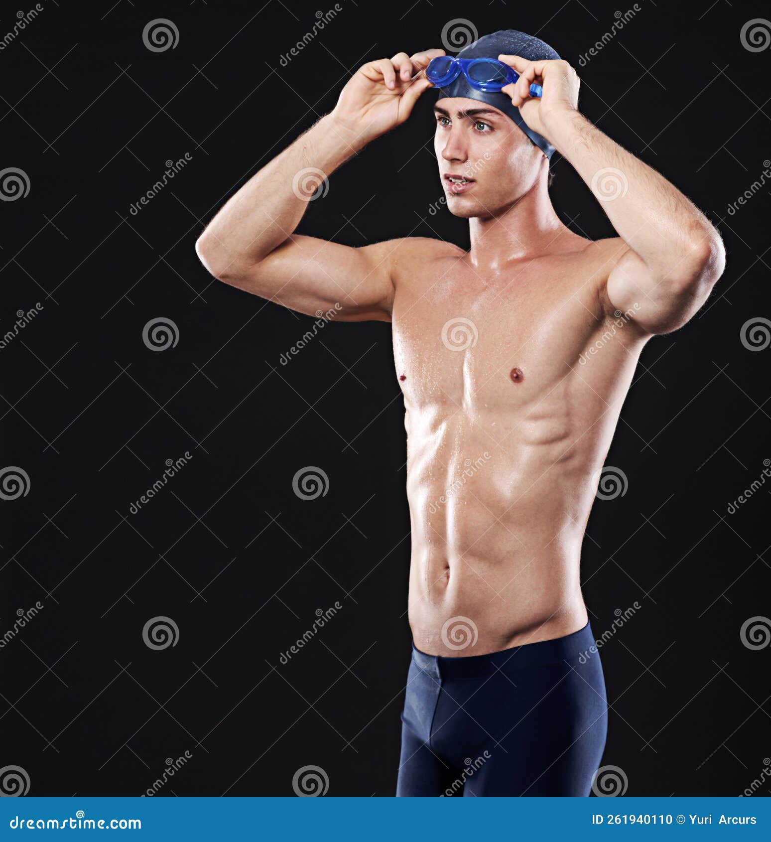 Keep Your Eye on the Prize. Studio Shot of a Muscular Young Swimmer ...