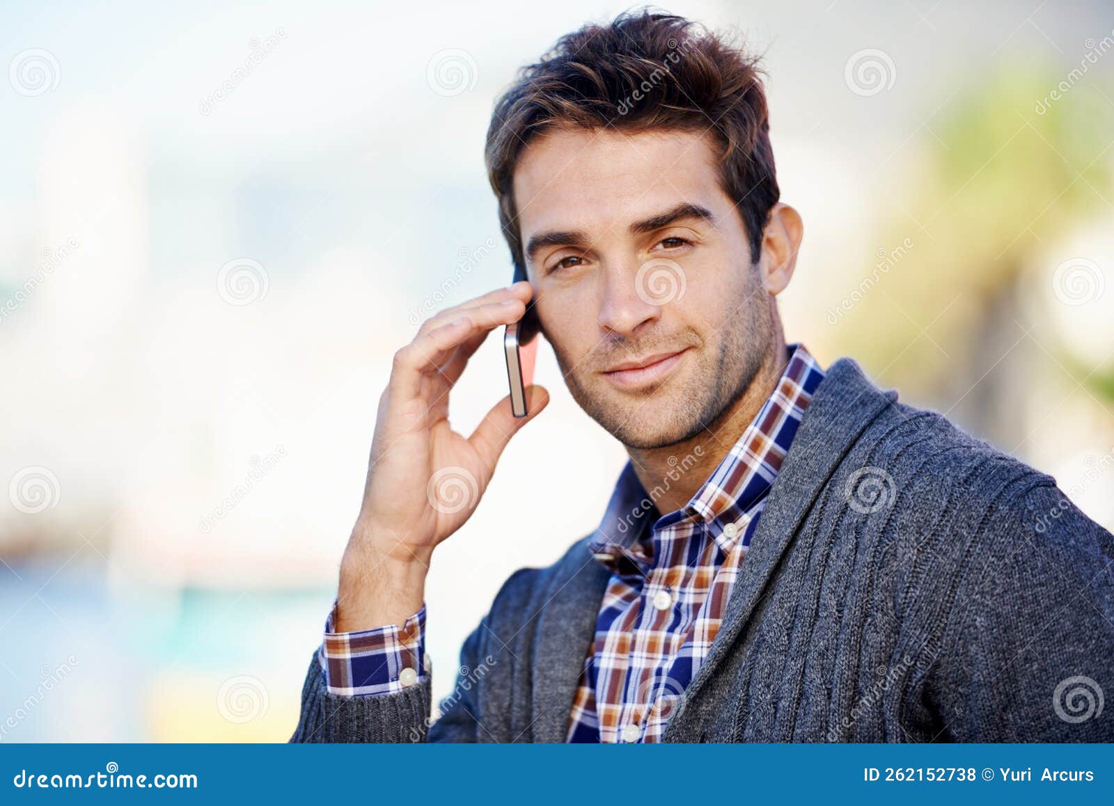 Keep Yourself Connected. a Handsome Young Man Making a Call on His ...