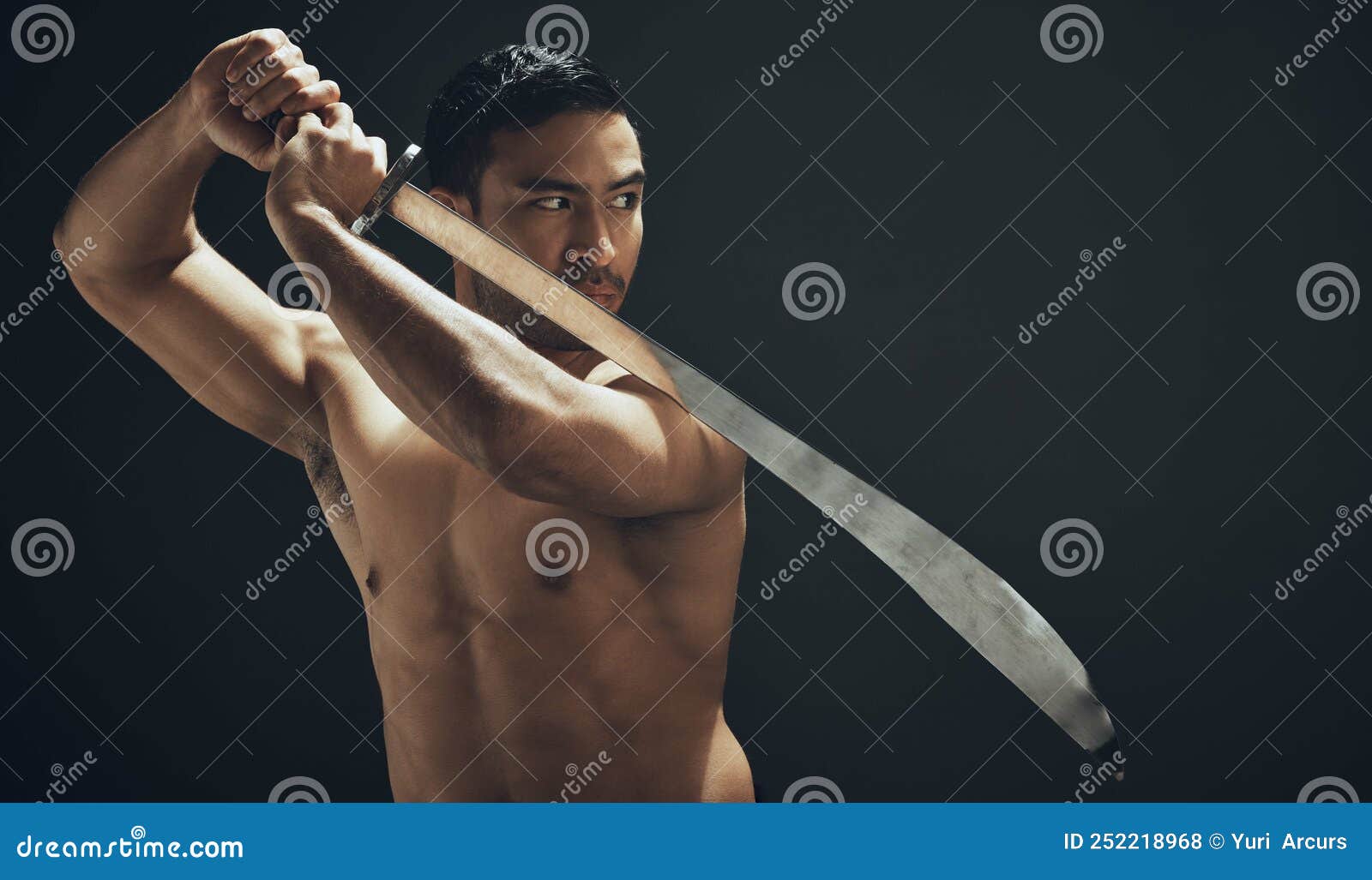 Keeping Ancient Techniques Alive. a Handsome Young Man Standing Alone ...