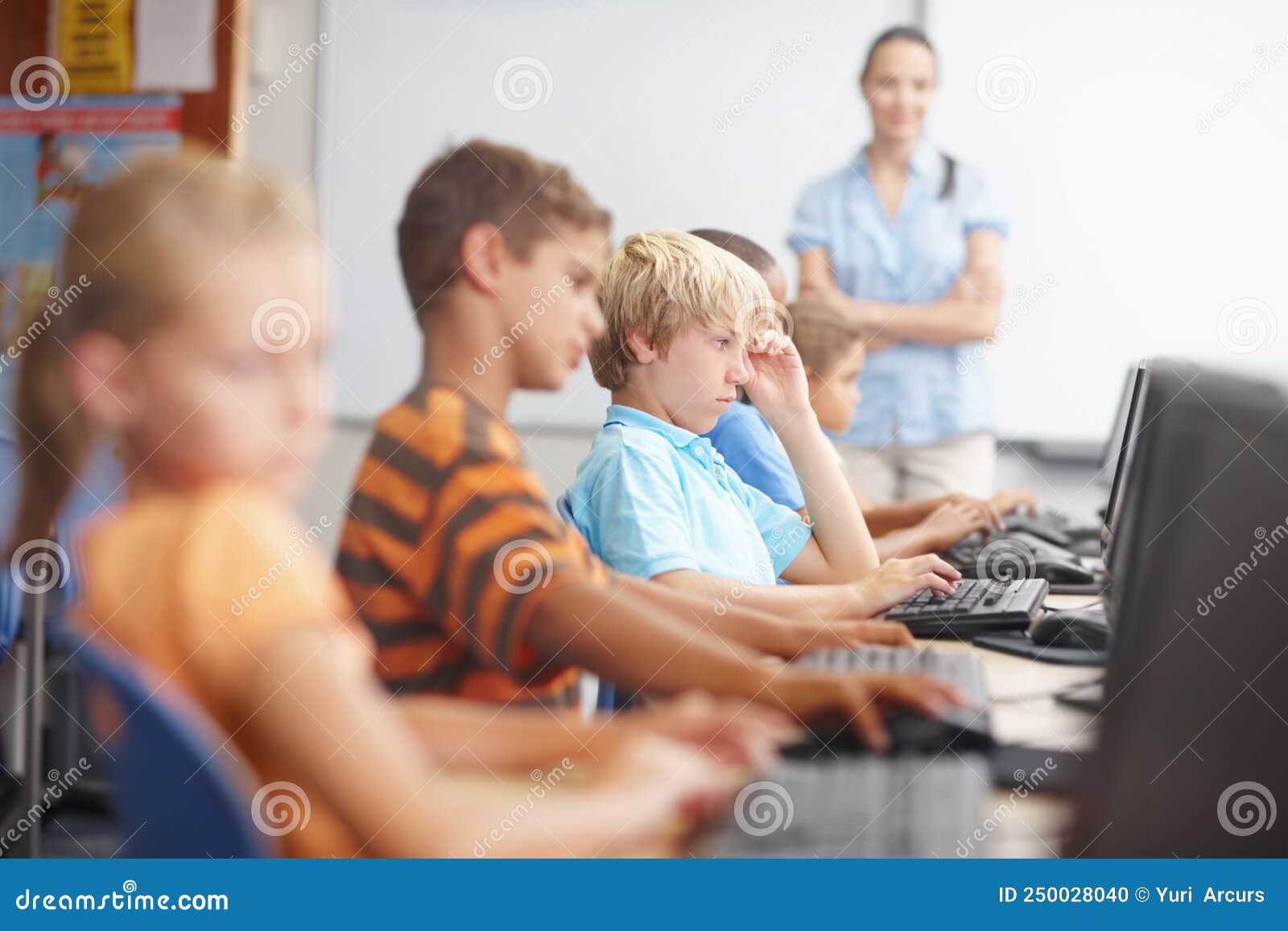 Keeping a Close Eye on Her Class. a Group of Young Kids Working Hard in ...