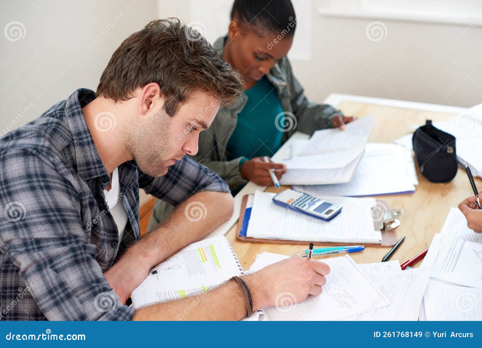 Keeping Each Other Focused. Three University Students Studying. Stock ...