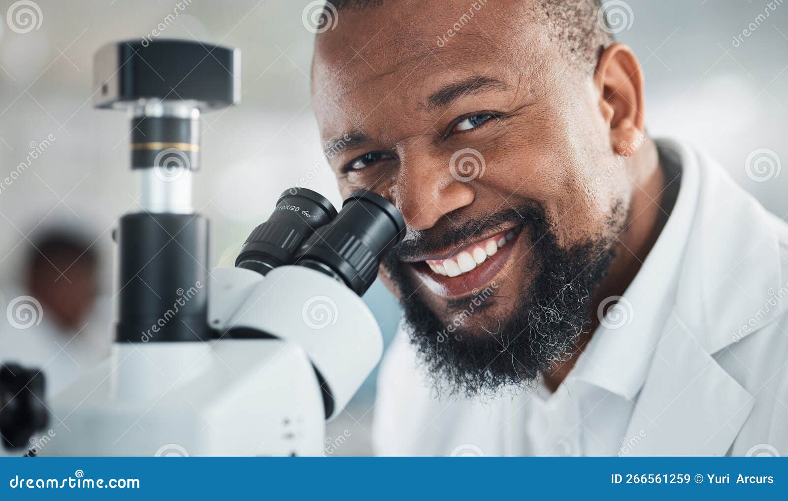 Keeping an Eye on the Reaction. a Mature Man Using a Microscope in a ...