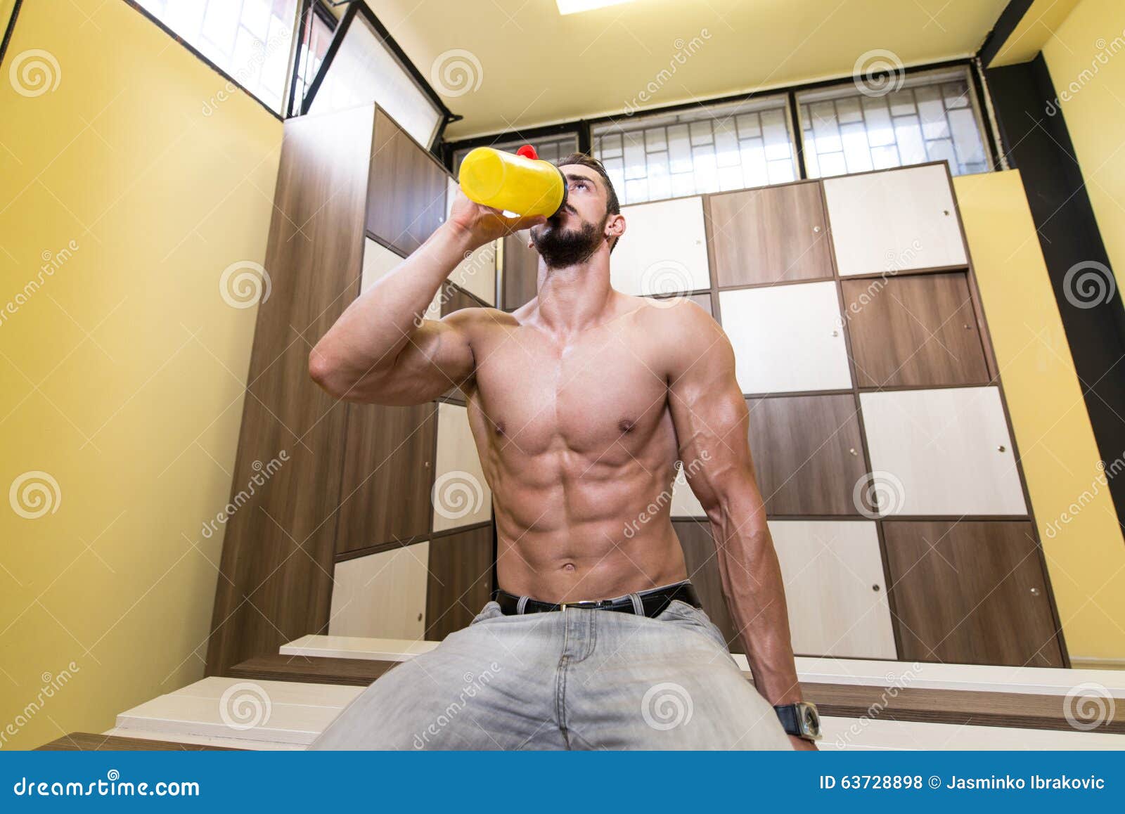 Keeping Himself Hydrated stock photo. Image of bodybuilder - 63728898