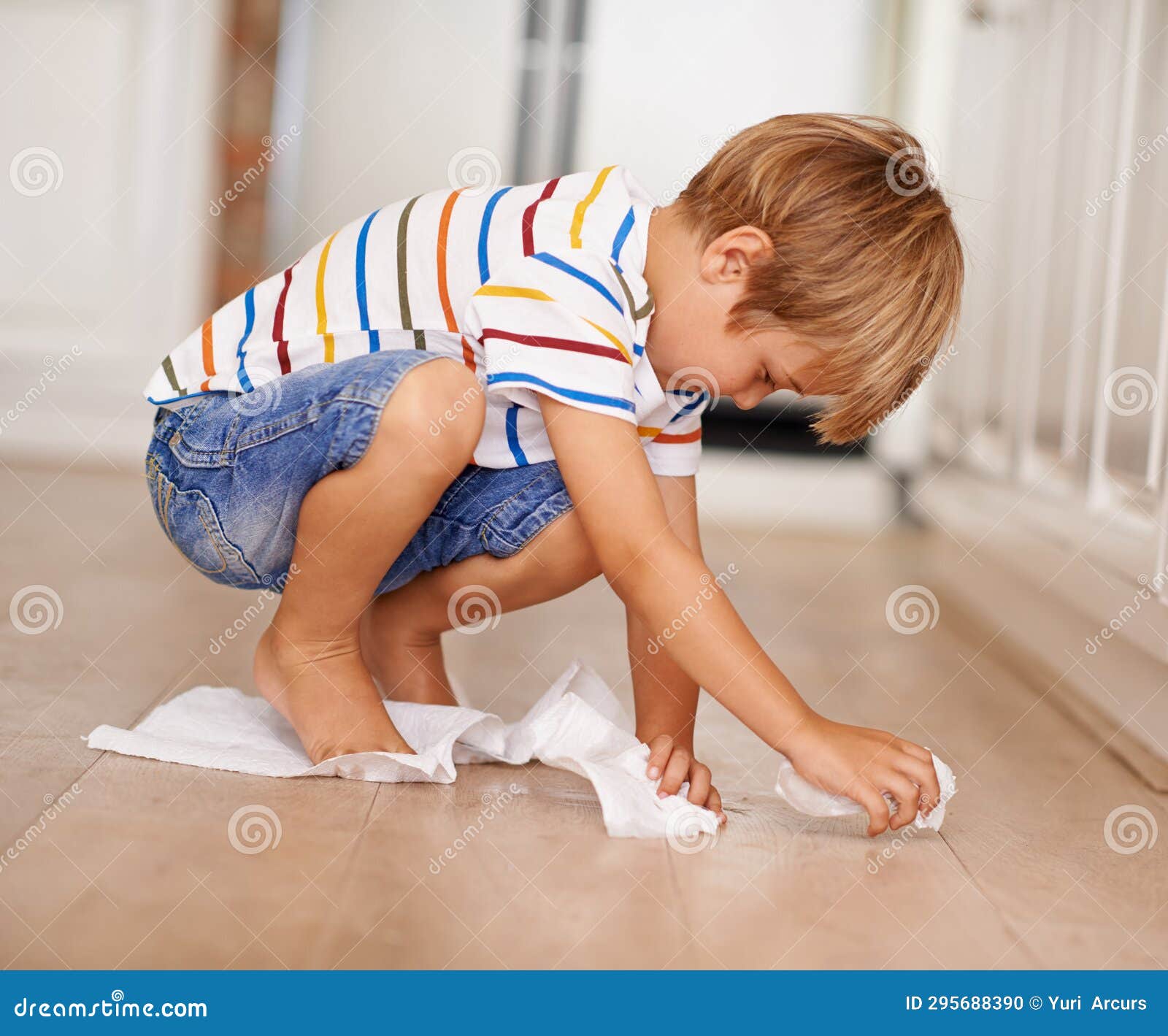 Keeping the House Clean. a Little Boy Playing on the Floor. Stock Photo ...