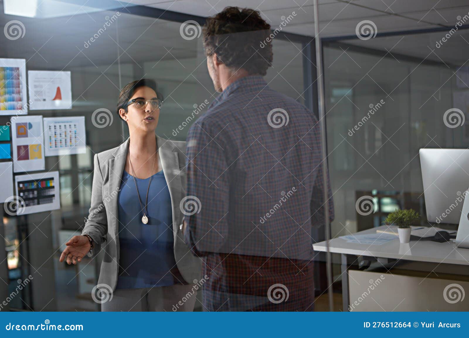 Keeping it Professional. Two Businesspeople Talking in the Office ...