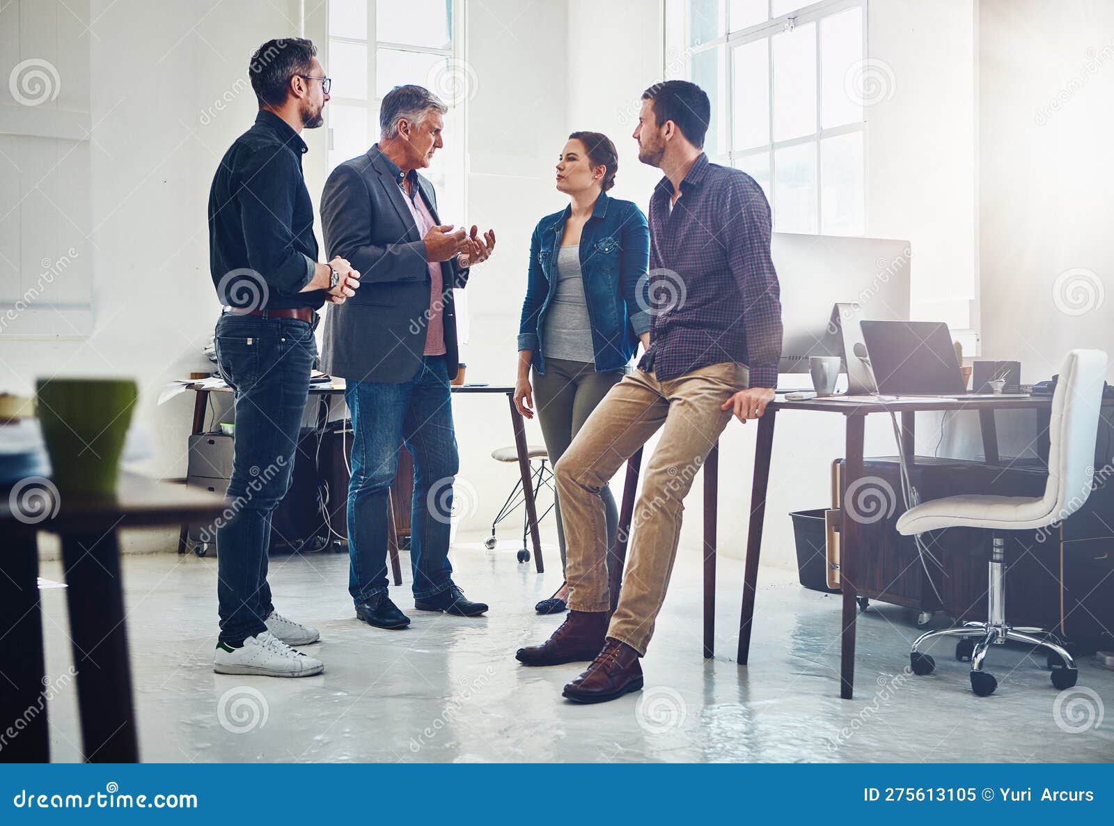 Keeping Their Brilliance on Target. a Group of Designers Having a ...