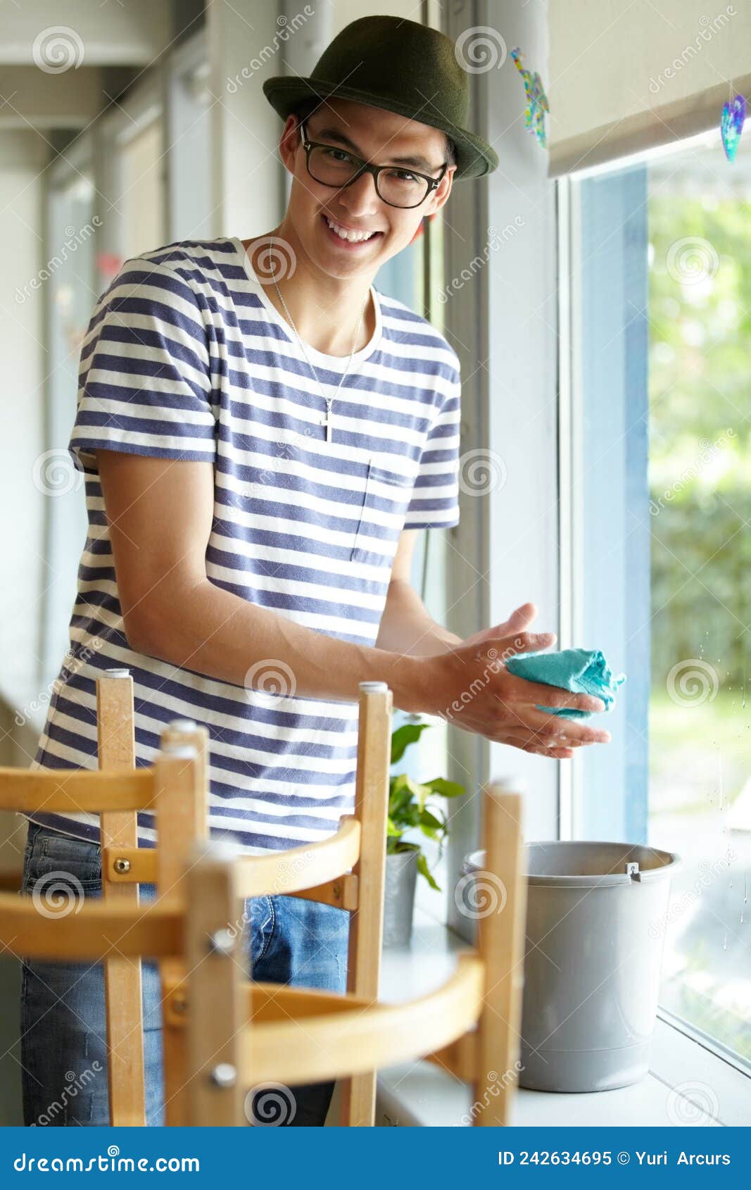 Keeping the Windows Clean. Young Guy Washing His Windows Inside. Stock ...