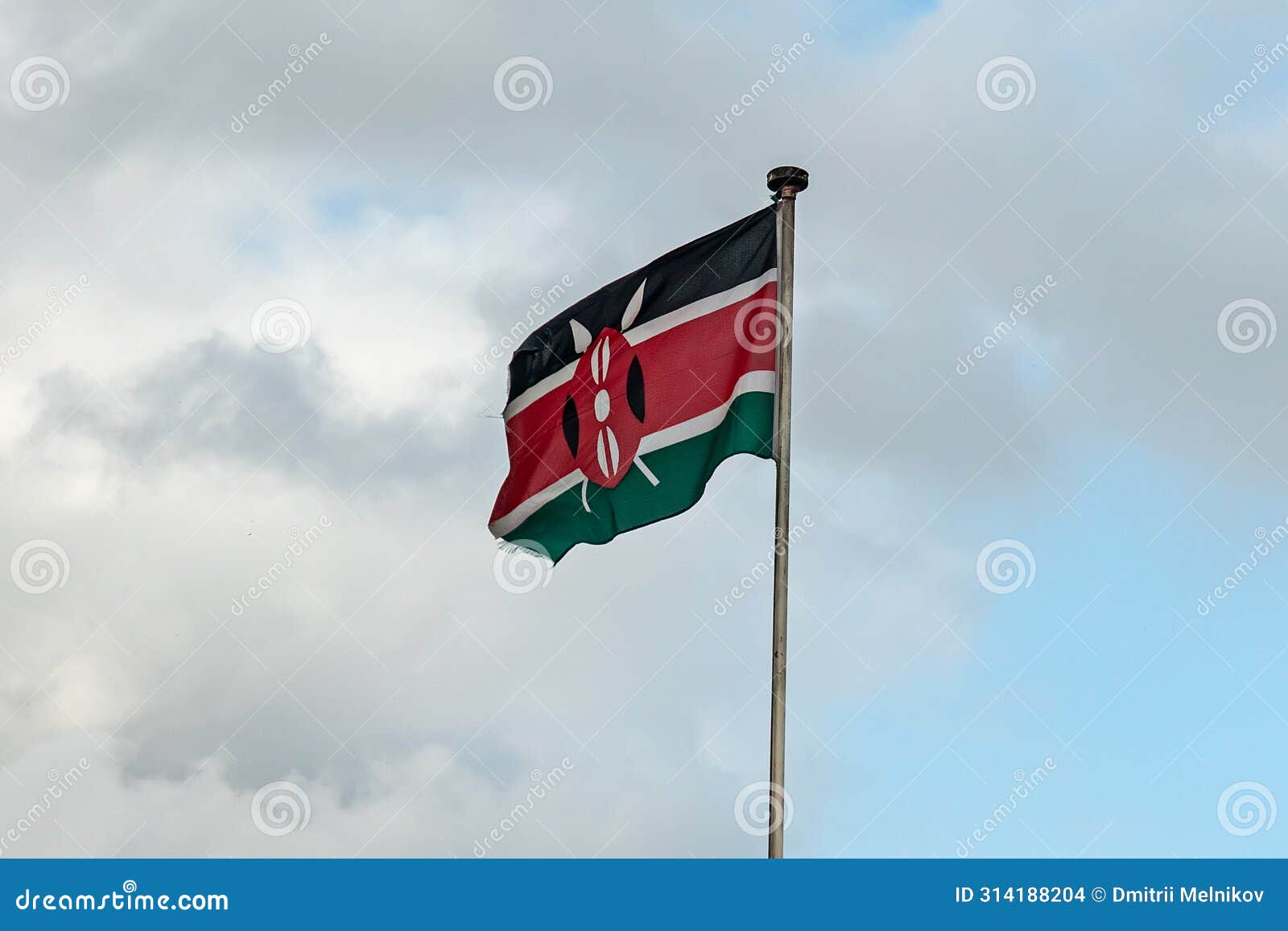 Kenya Flag Waving in Wind Against the Background of a Blue Cloudy Sky ...
