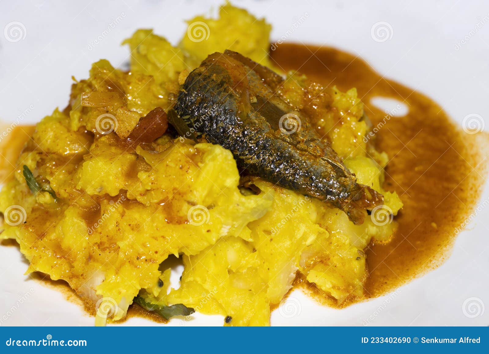 Kerala Style Yellow Tapioca with Fish Curry in White Background ...