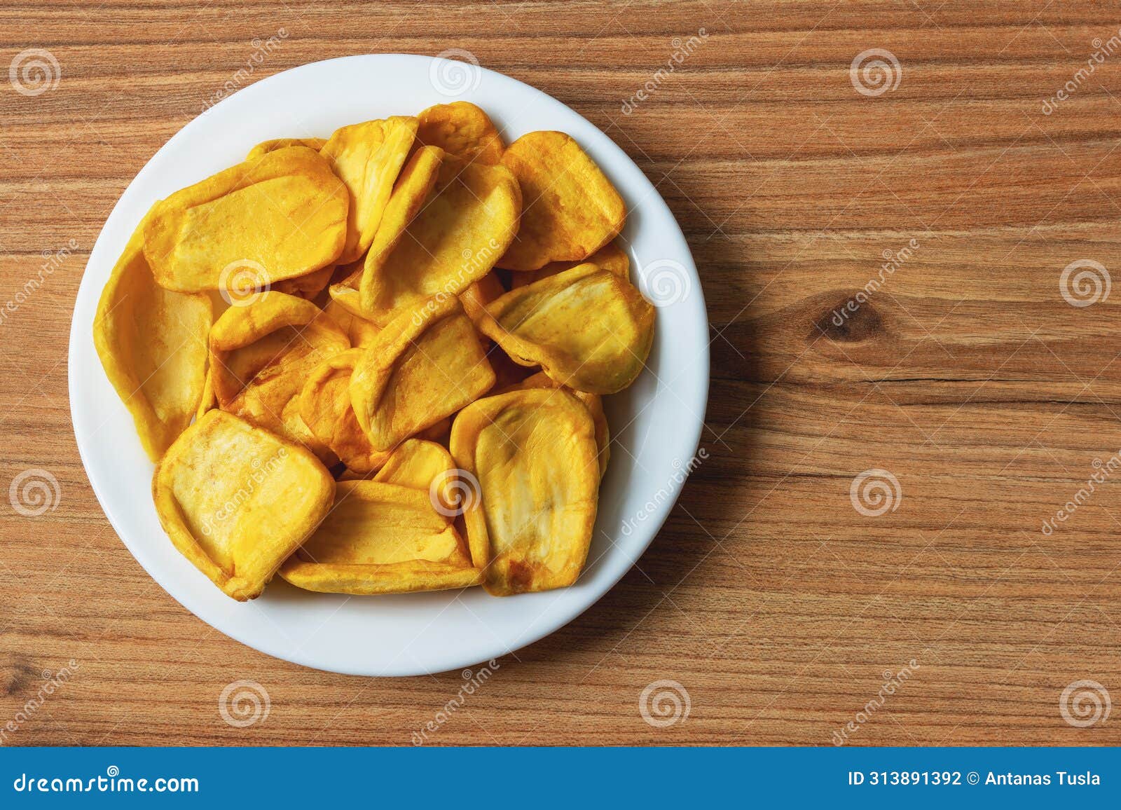 Keripik Sukun or Breadfruit Chips is a Food Made from Breadfruit in a Plate on a Pine Table ...