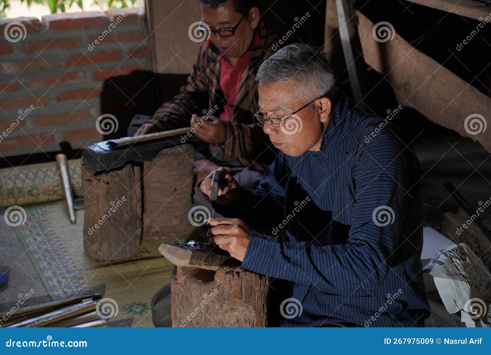 Keris Craftsmen are Teaching Visitors about the Process of Making Keris ...