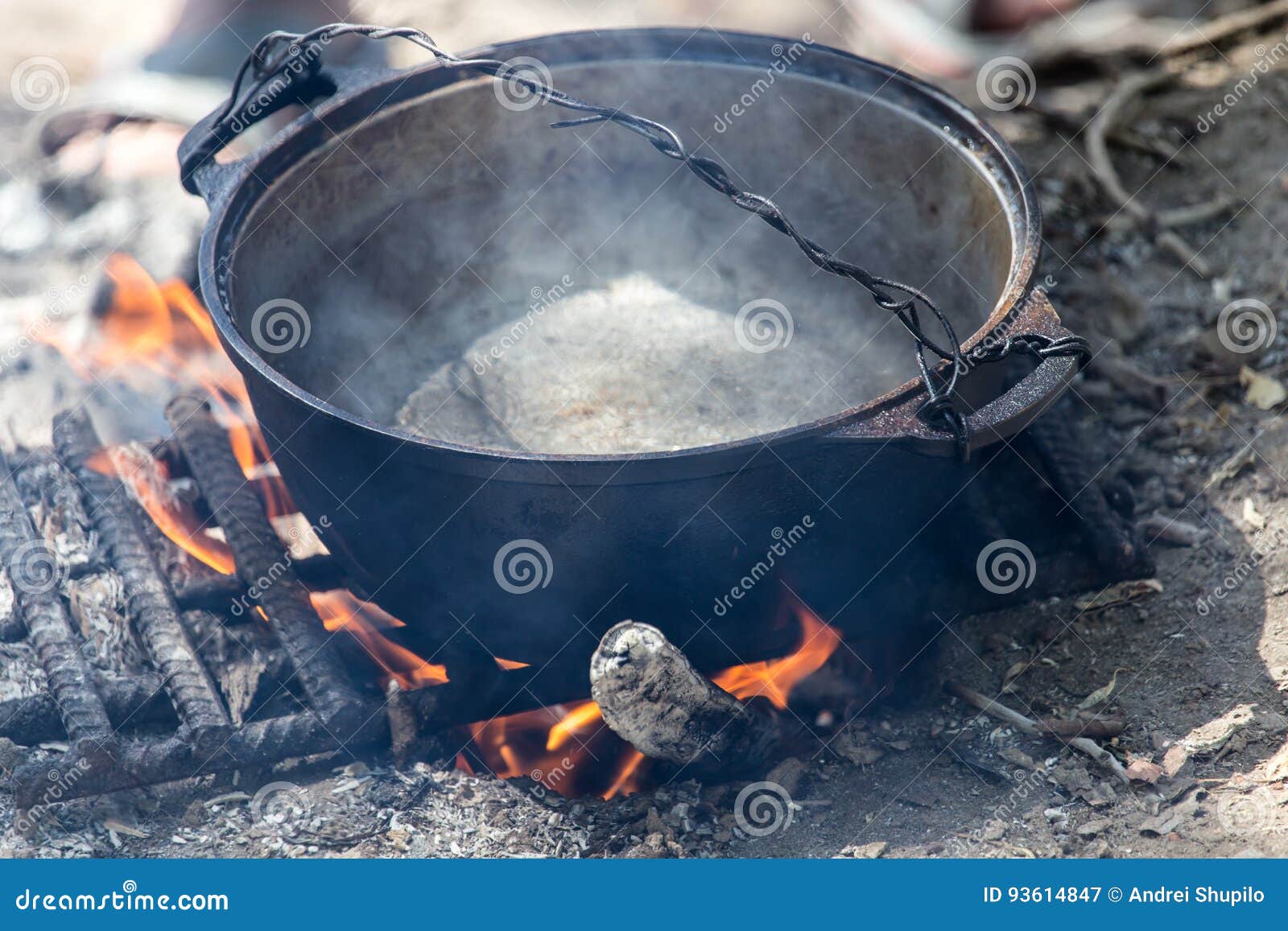 Kettle on a fire in nature stock image. Image of burn - 93614847