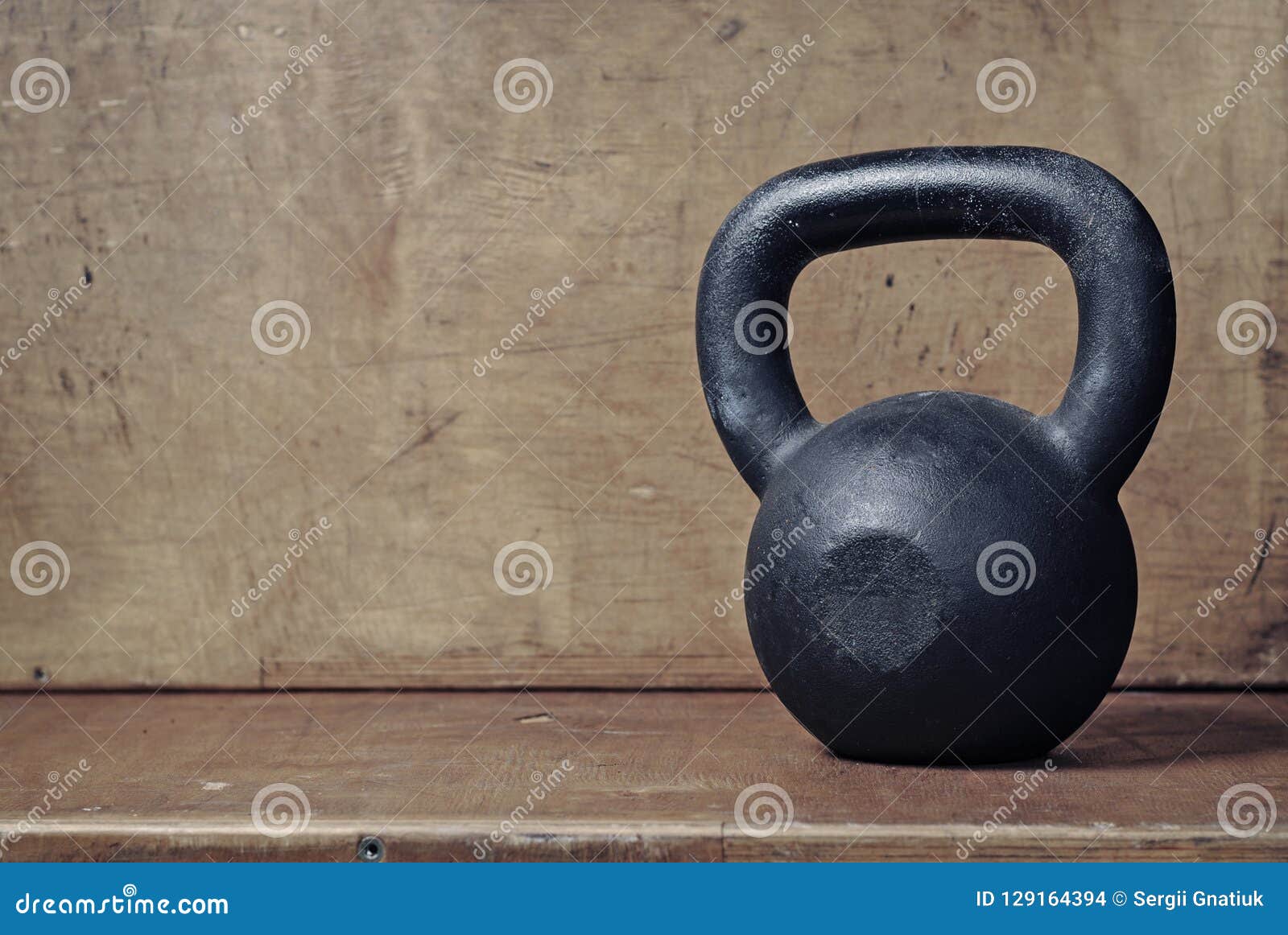 Kettlebell in Black on Wooden Background Stock Photo - Image of ...
