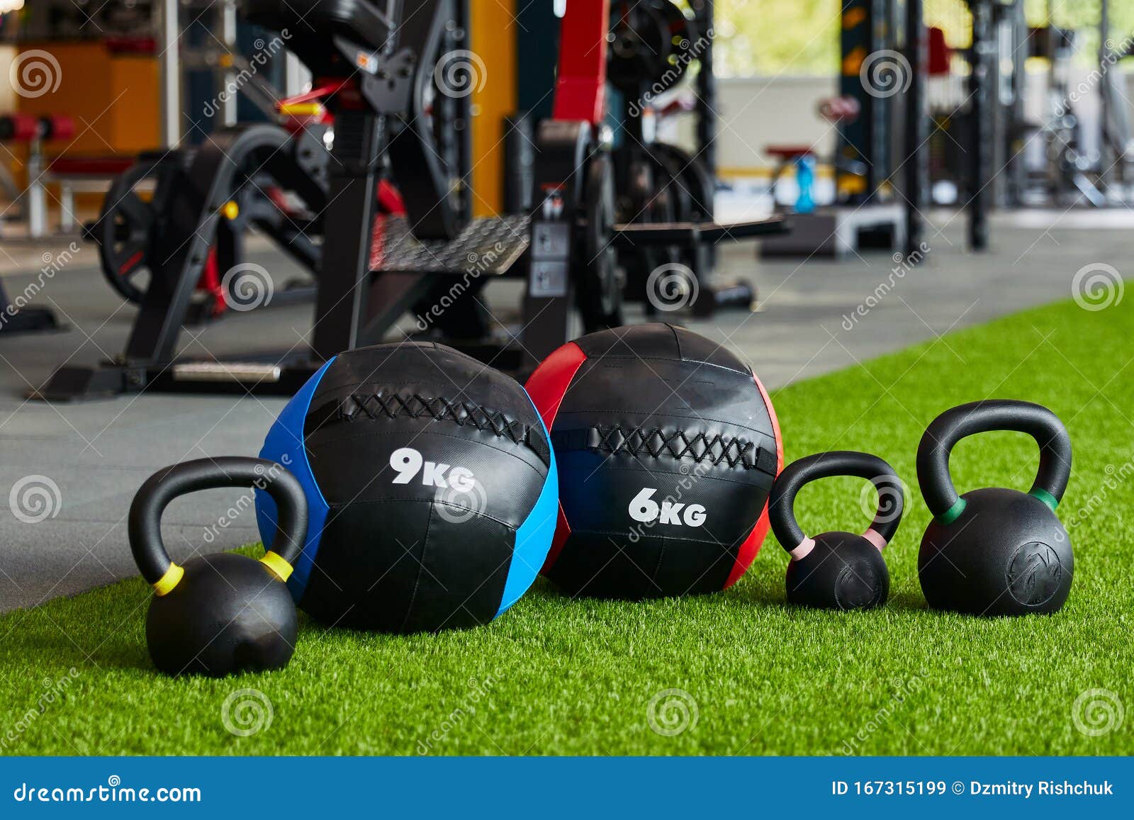 Kettlebells of Different Sizes and Different Weights are in a Row ...