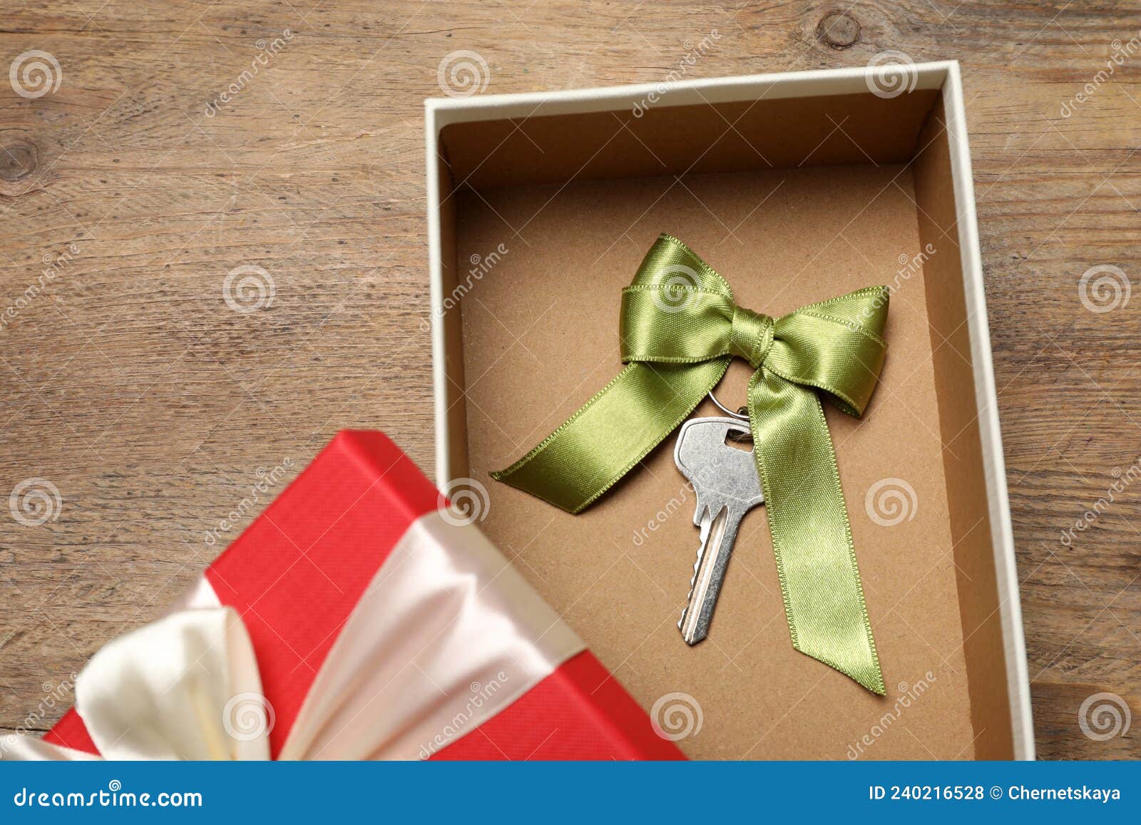 Key with Bow in Gift Box on Wooden Table, Top View. Housewarming Party ...