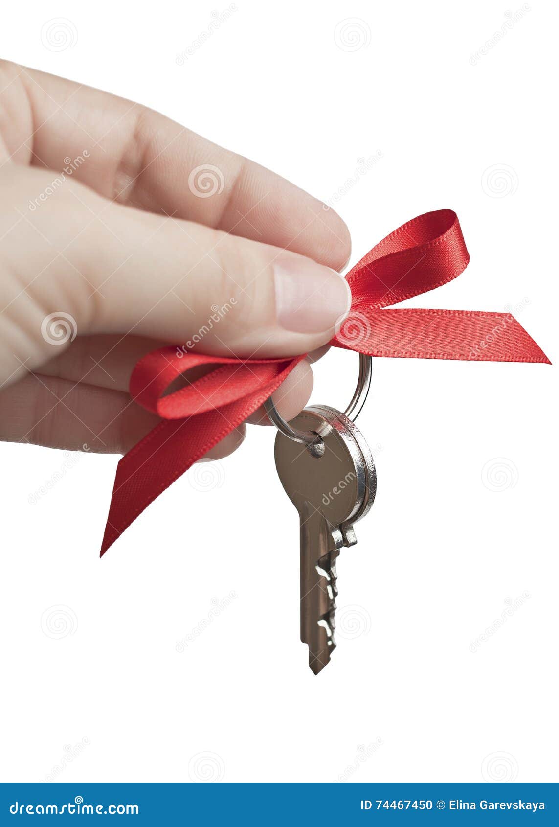 The key with bow in hand stock photo. Image of close - 74467450