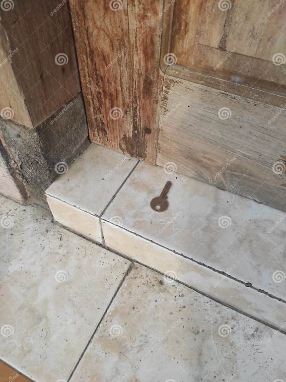 Key on the dusty floor stock image. Image of wall, beam - 265289695