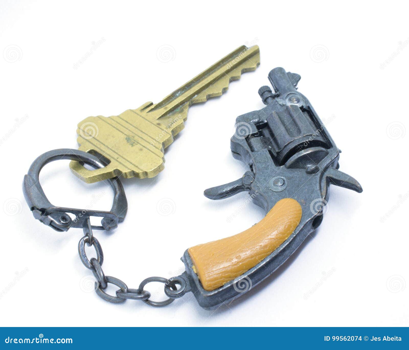 Key on a gun key-chain stock photo. Image of firearm - 99562074