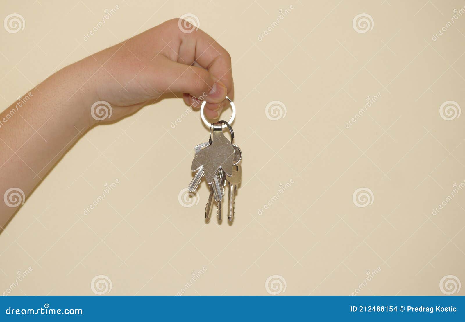 Key in hand. stock photo. Image of object, yellow, boys - 212488154