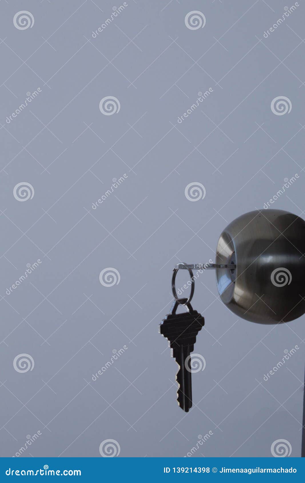 Key hanging from its lock stock photo. Image of safety - 139214398