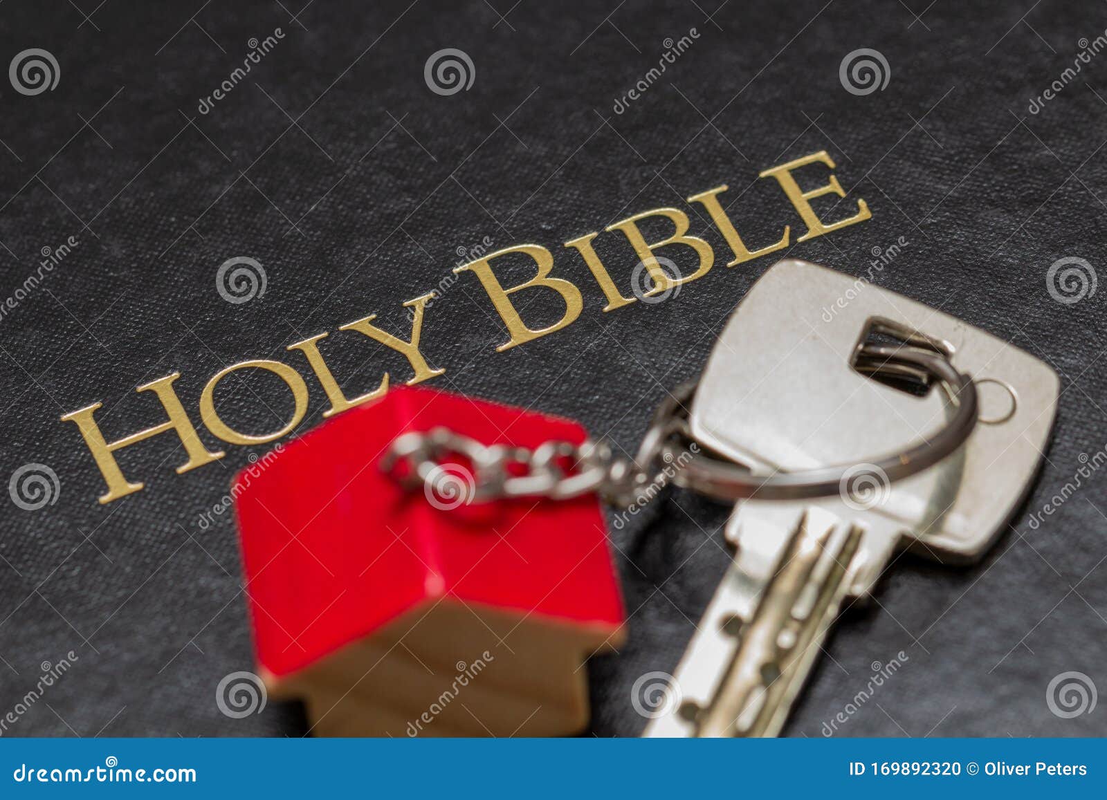 Key with House Shaped Key Chain on Bible Stock Photo - Image of real ...