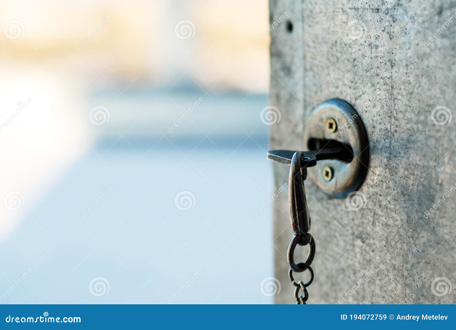 A Key is Inserted in the Keyhole, the Doors are Open To the Outside ...