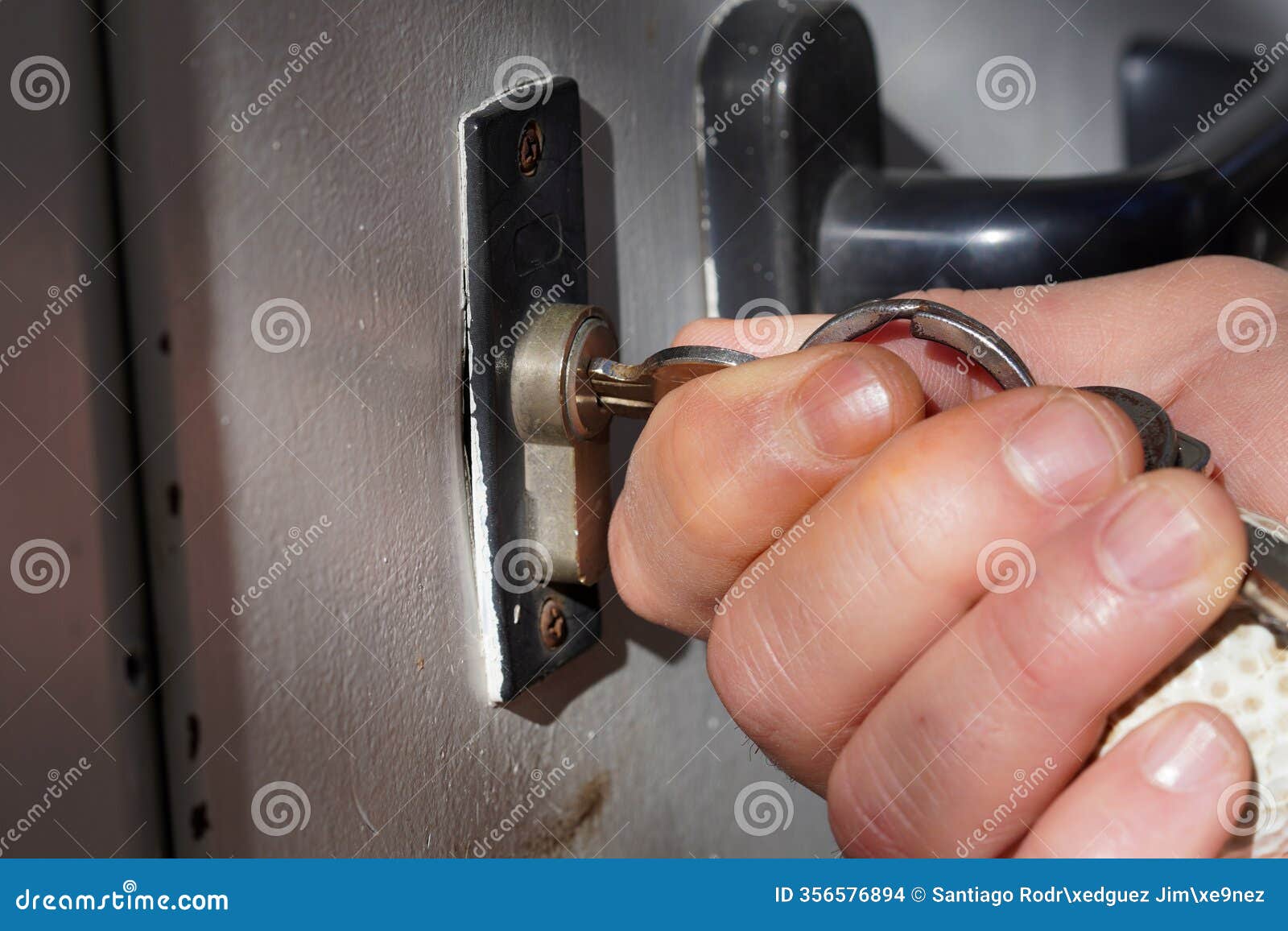 Key inserted in a lock stock photo. Image of hanging - 356576894