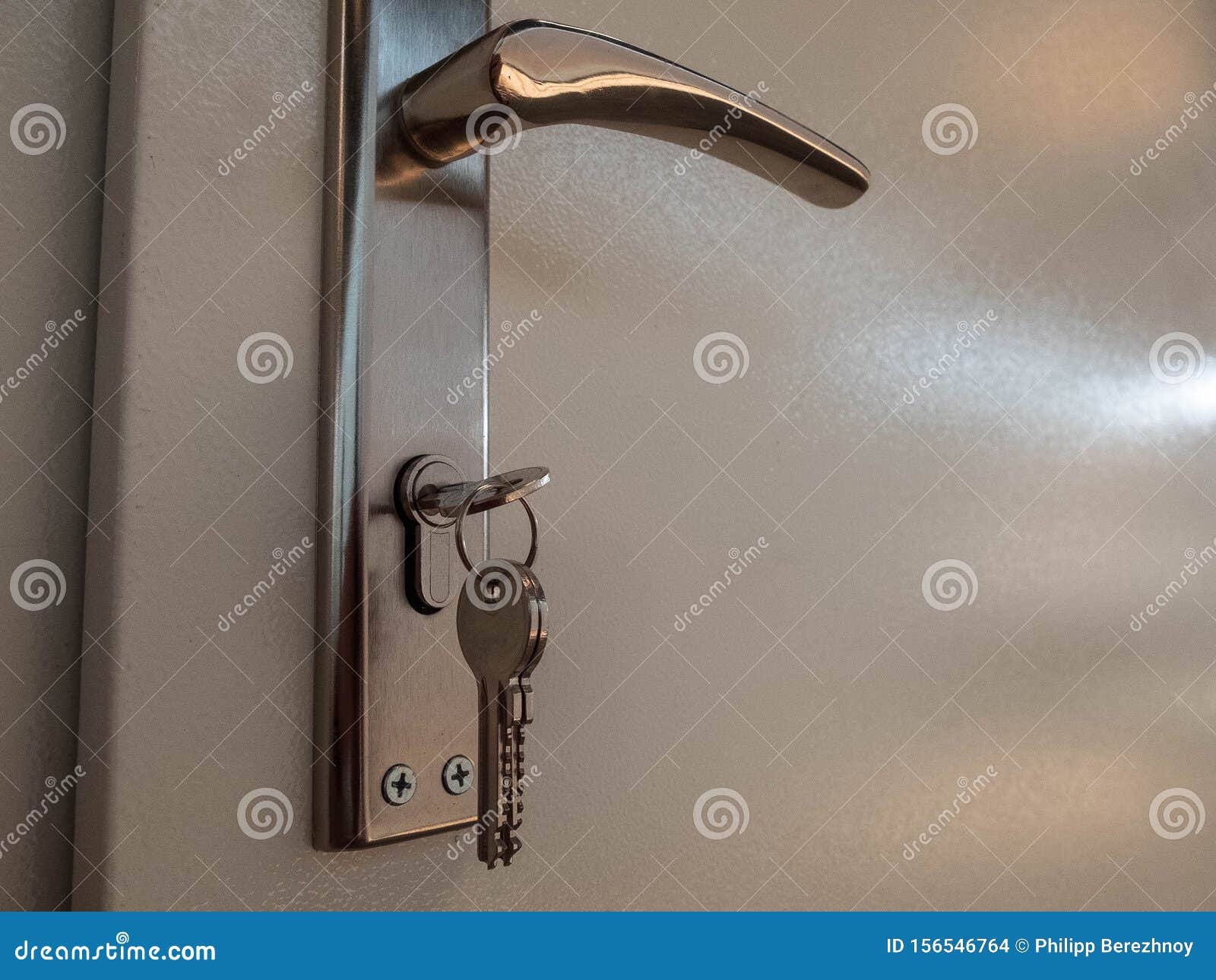 Key on the Key Chain Inside the Door Keyhole Stock Photo - Image of ...