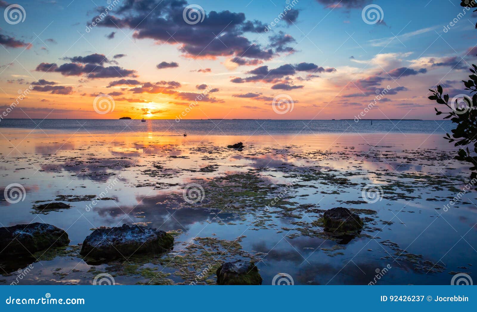 Key Largo Sunset with Clouds, Boat and Water Stock Image - Image of ...