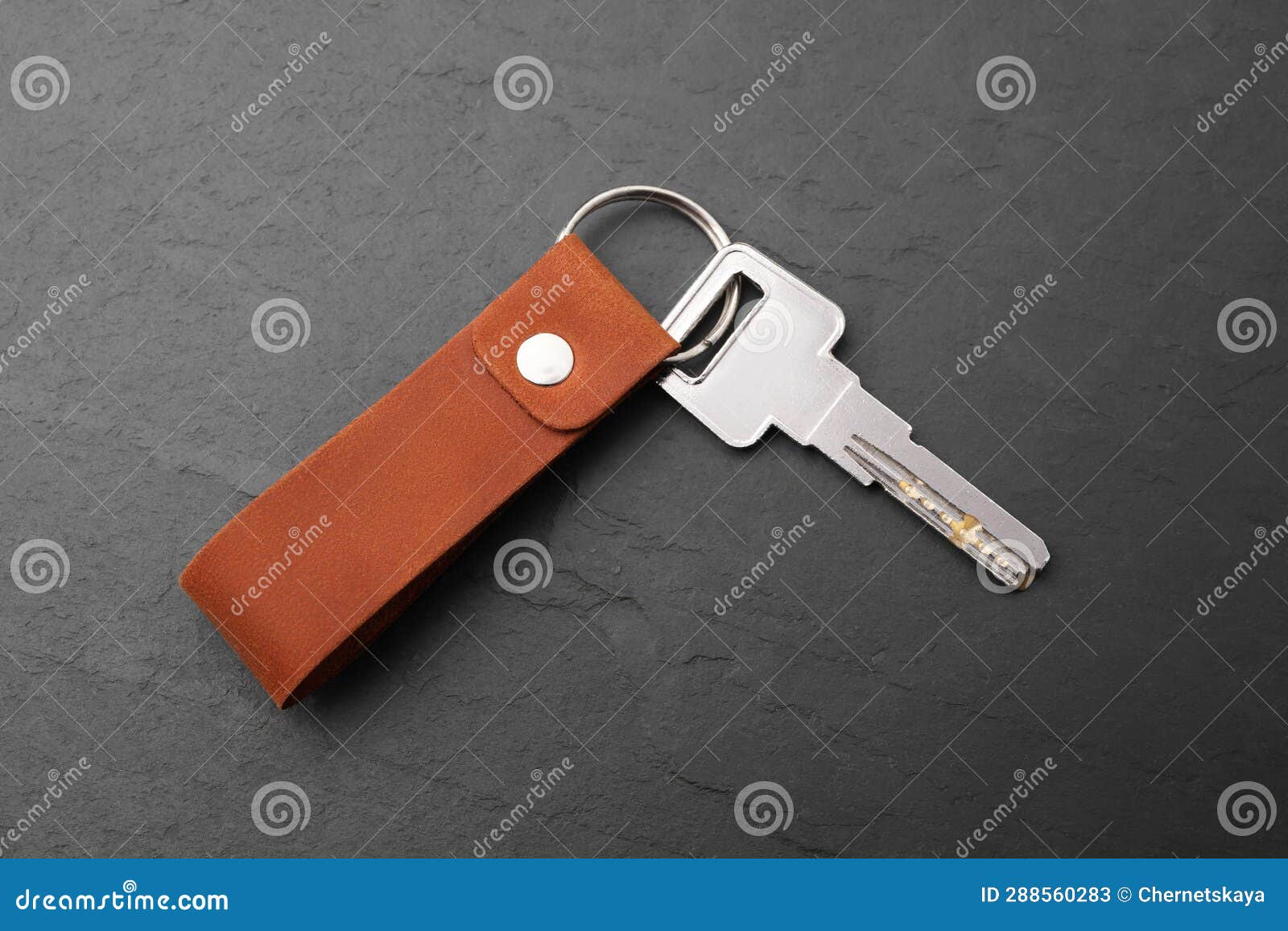 Key with Leather Keychain on Black Background, Top View Stock Image ...
