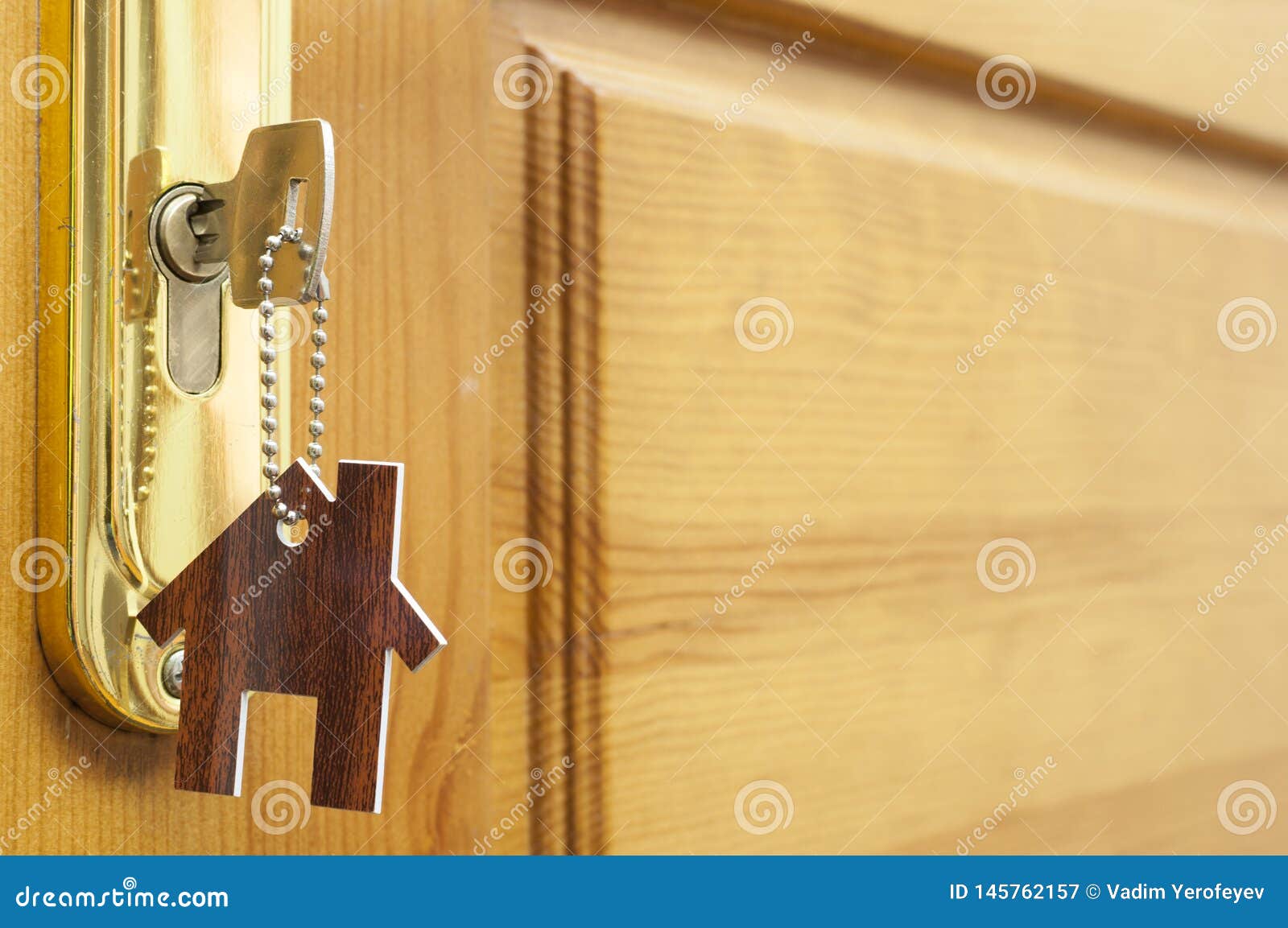 A Key in a Lock with House Icon on it Stock Image - Image of real ...
