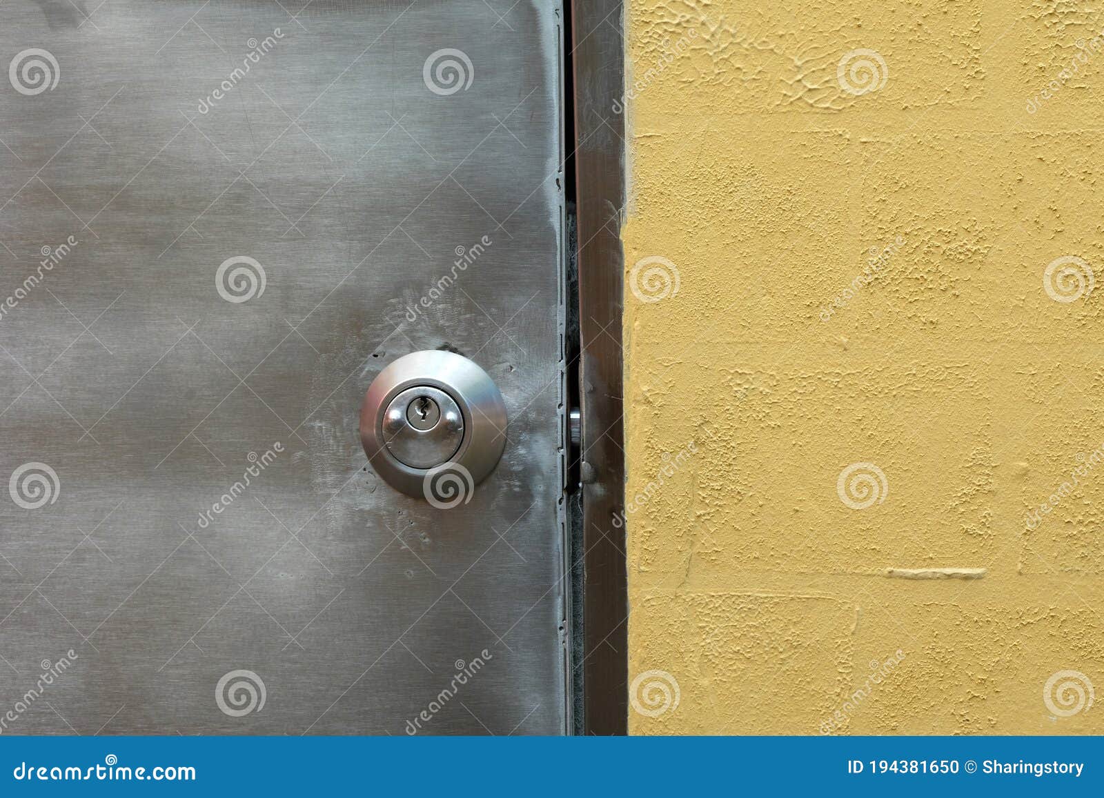 Key lock on the steel door stock photo. Image of house - 194381650